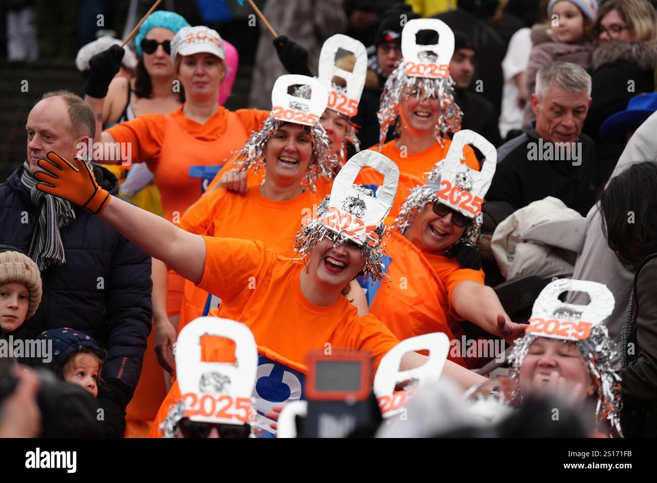 People take part in the Loony Dook New Year's Day dip in the Firth of ...