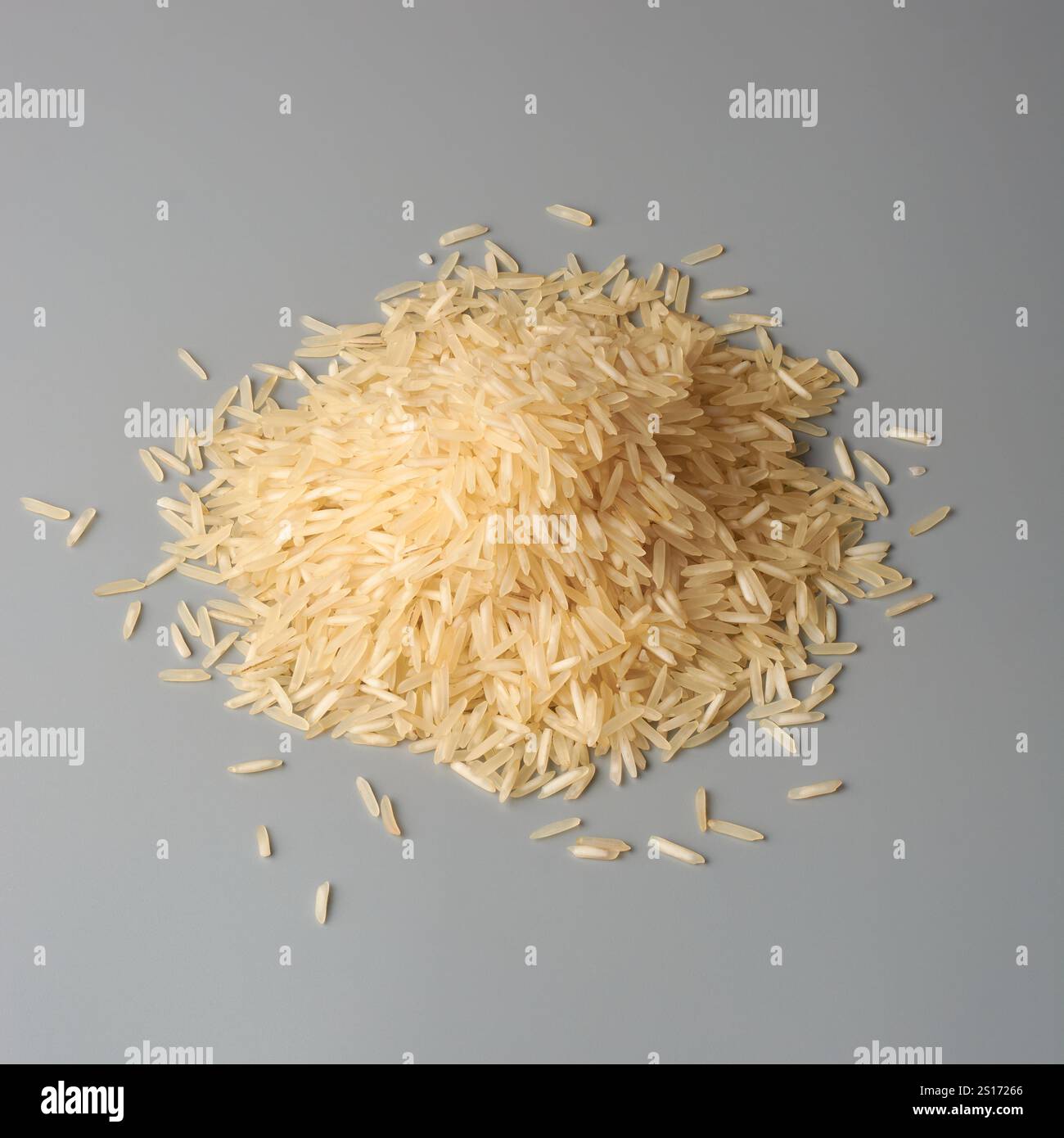 pile of raw basmati rice grains isolated neutral gray background ...