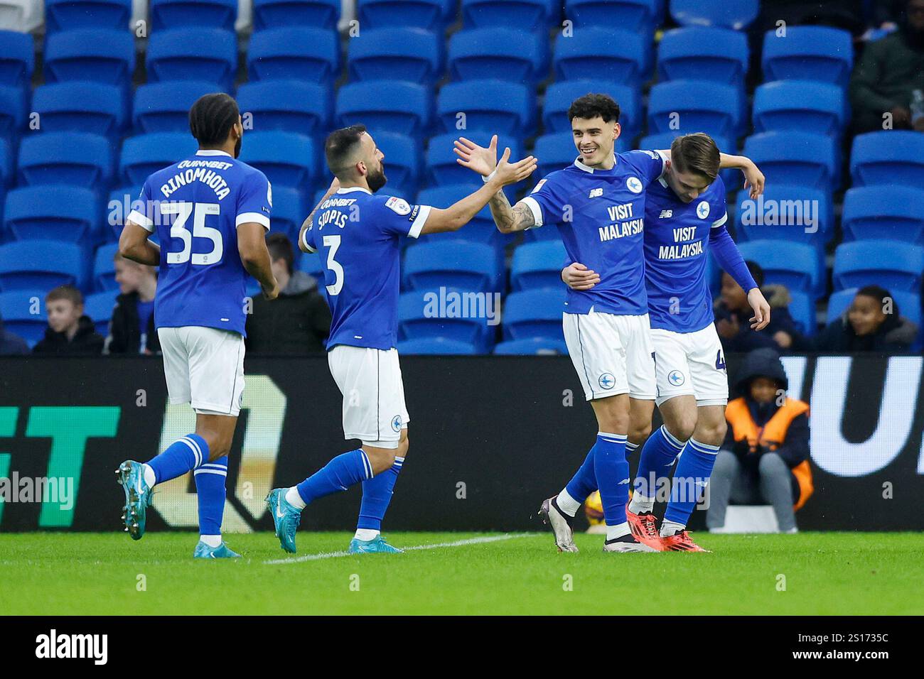 Cardiff City's Alex Robertson (second right) celebrates with team-mates ...