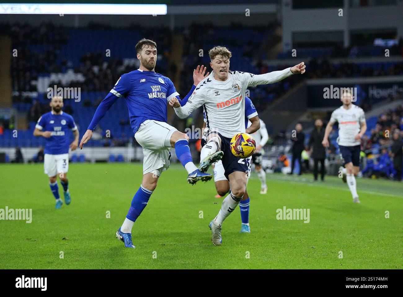 Coventry City's Victor Torp (right) and Cardiff City's Calum Chambers ...