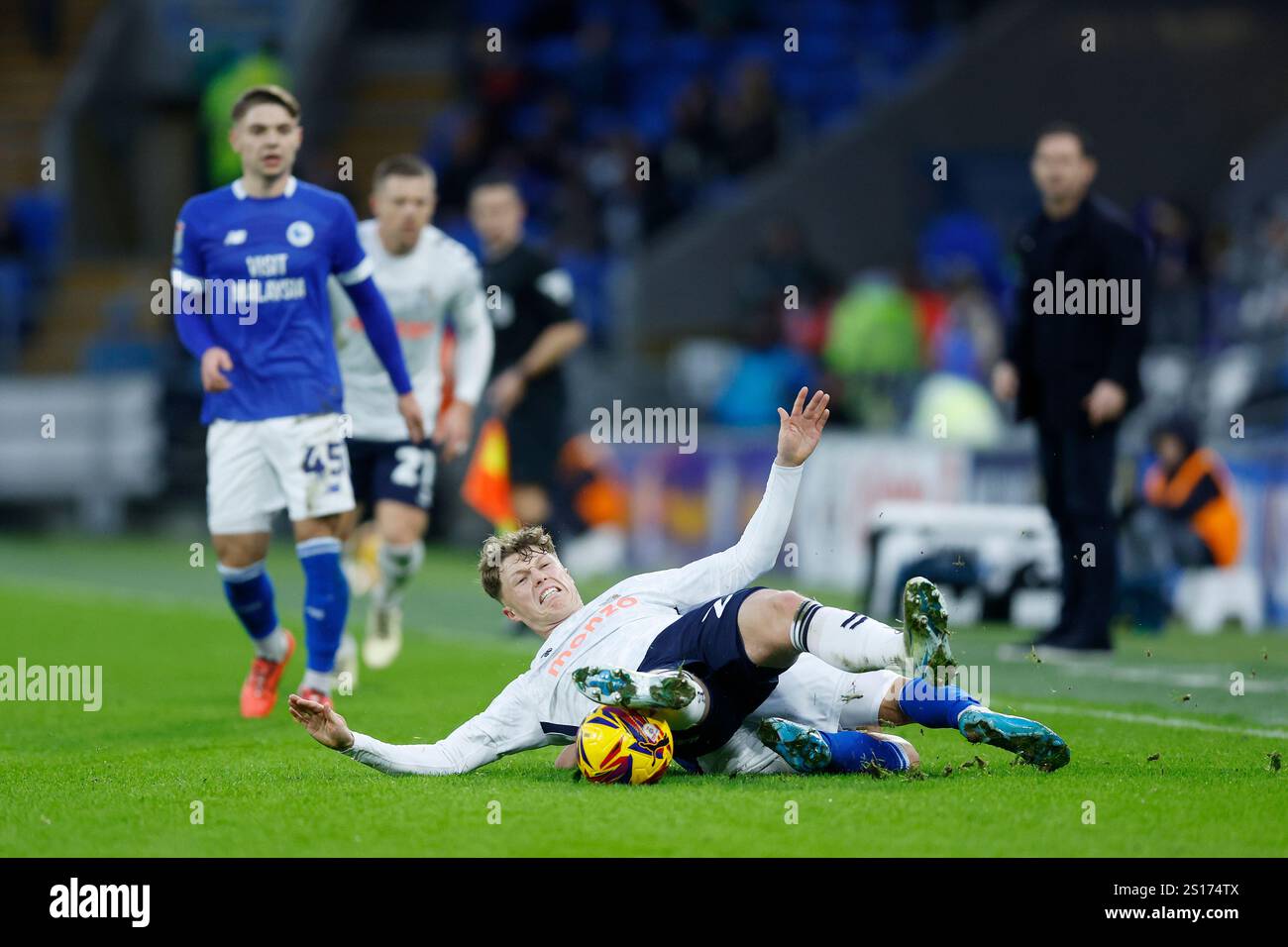 Coventry City's Victor Torp (centre left) is tackled by Cardiff City's ...