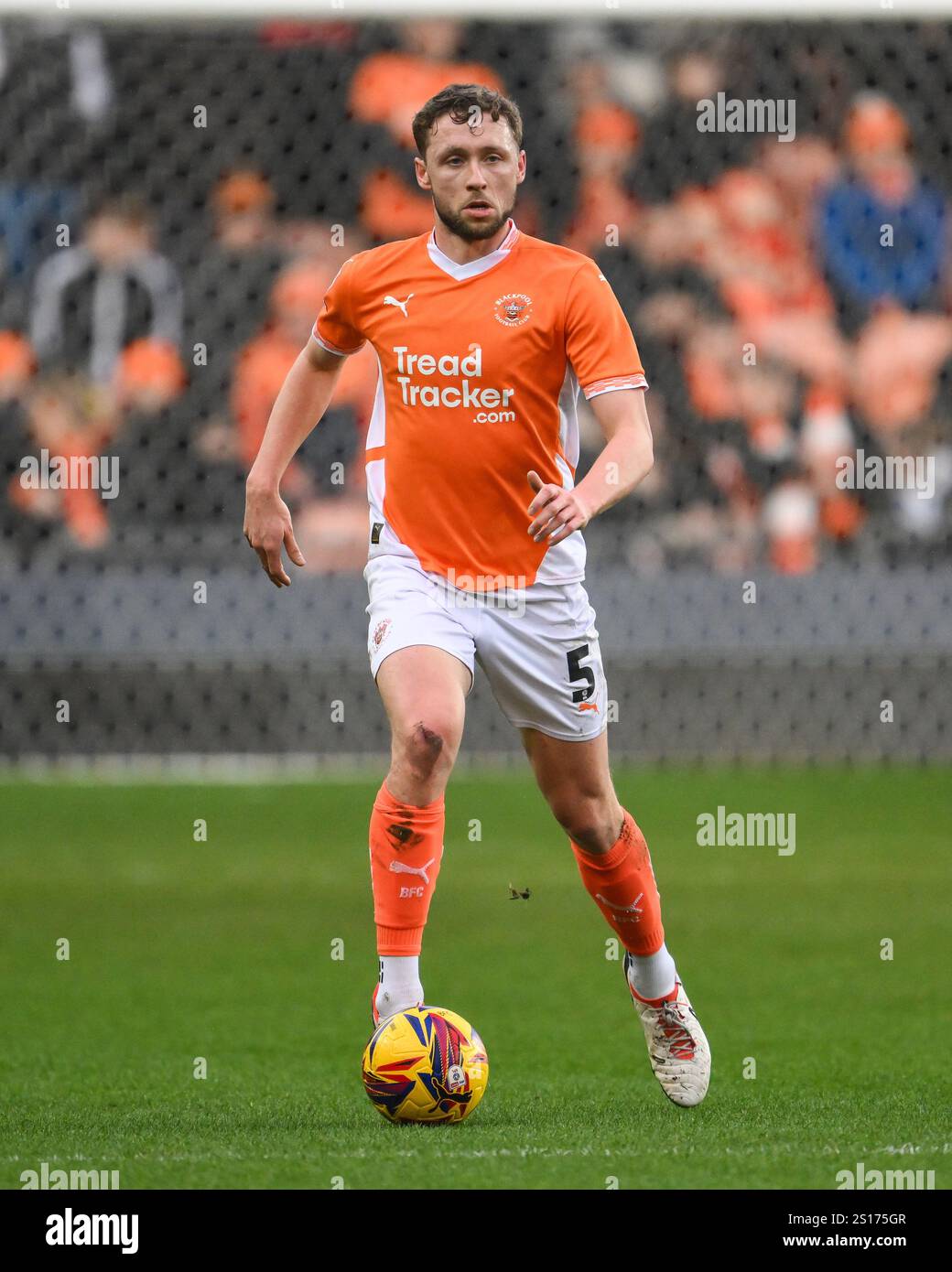 Matthew Pennington of Blackpool makes a break with the ball during the ...