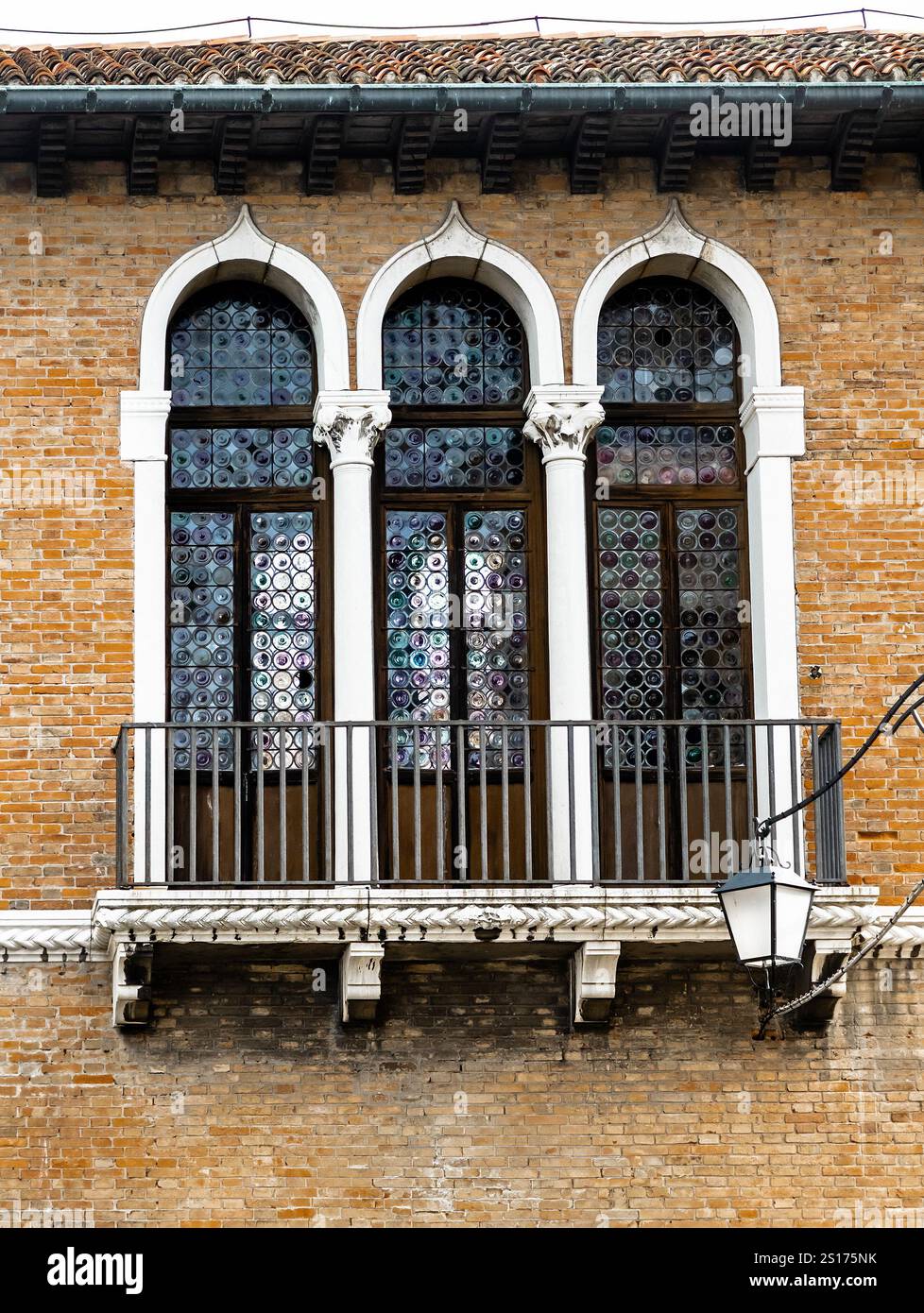 Tall closed windows exterior on a brick wall facade Stock Photo - Alamy