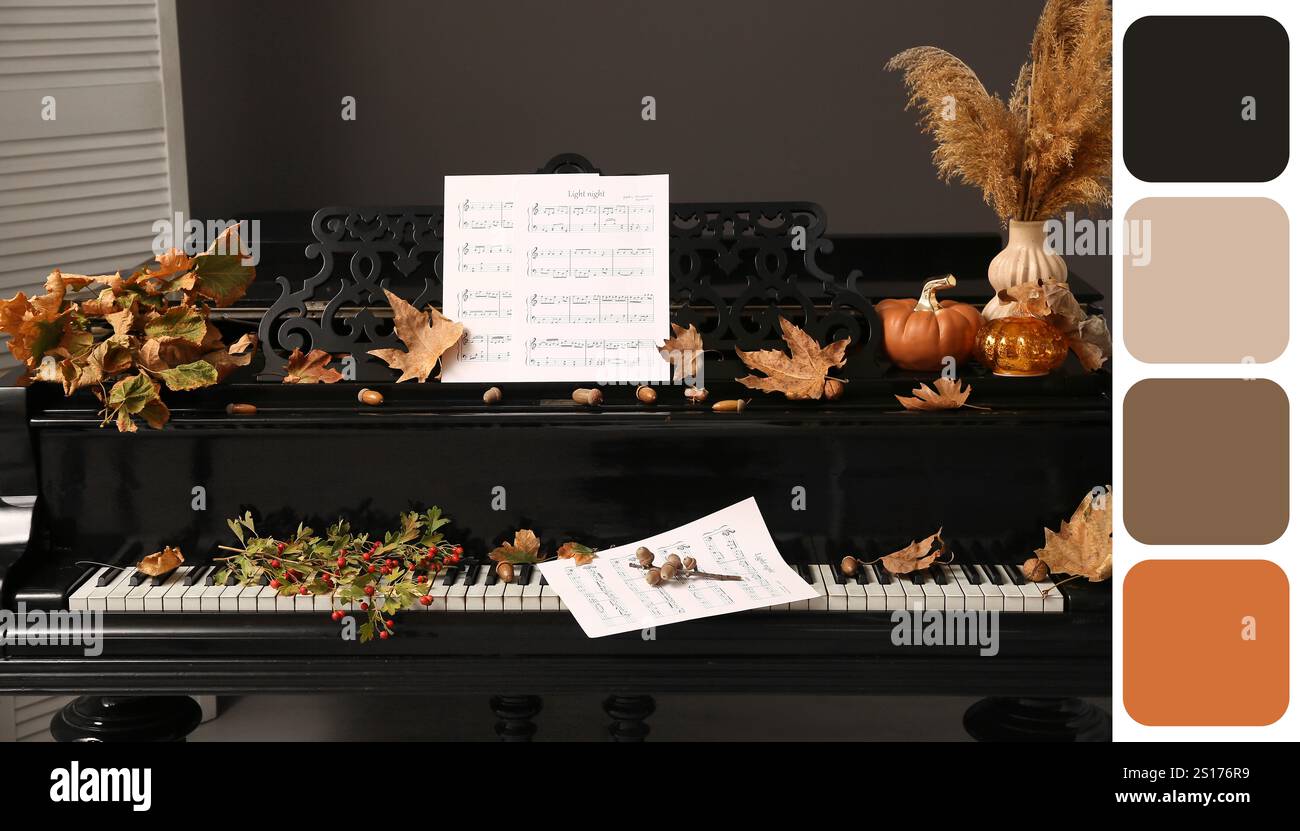 Autumn leaves, pumpkins and note sheets on grand piano. Different color ...