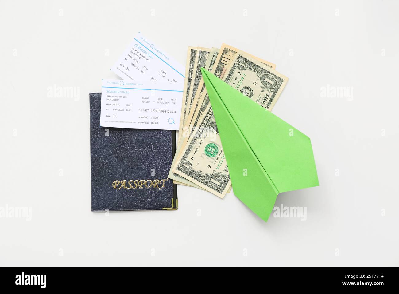 Paper plane, money, tickets and passport on white background Stock ...
