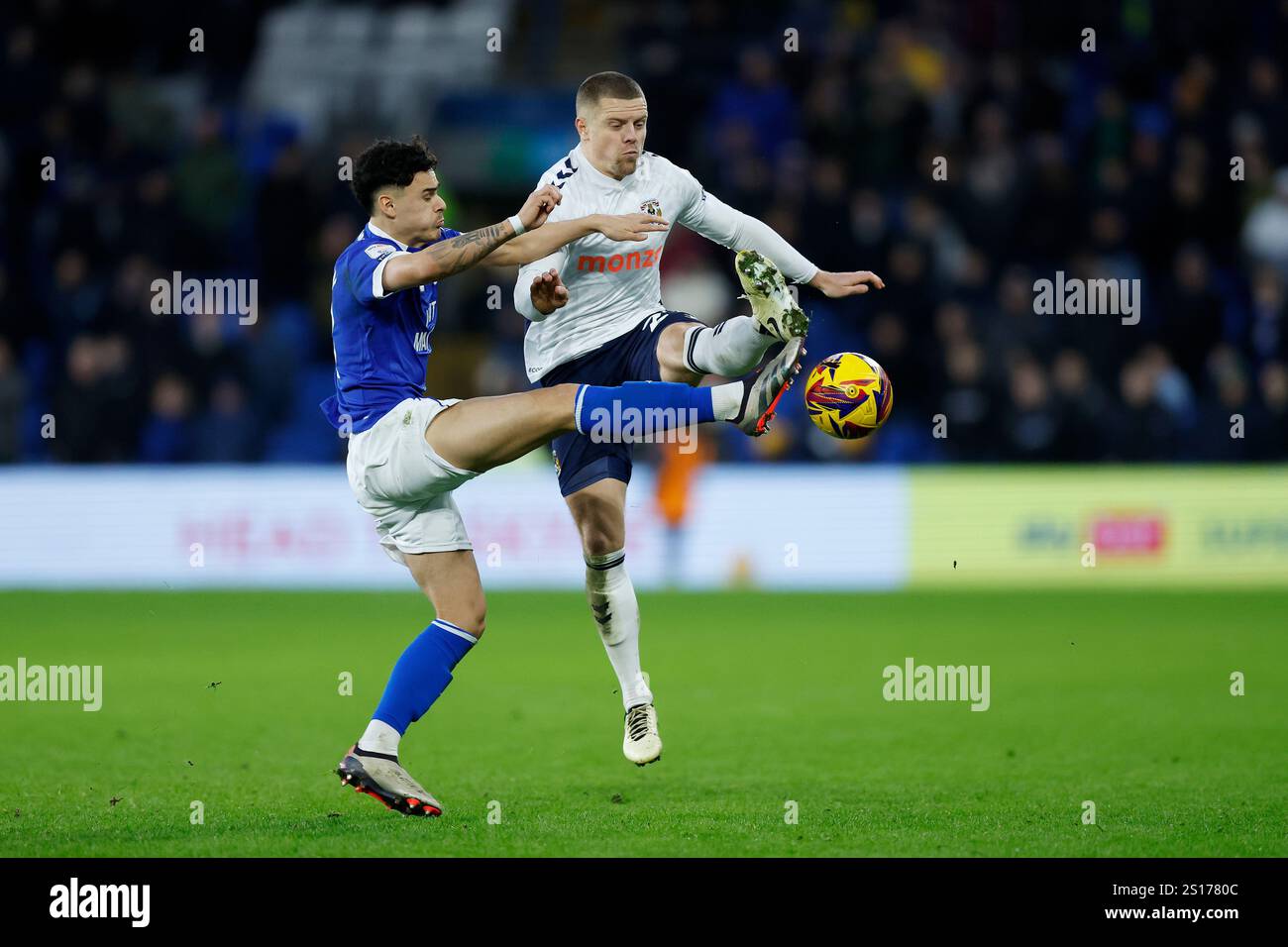 Coventry City's Jake Bidwell (right) and Cardiff City's Alex Robertson ...