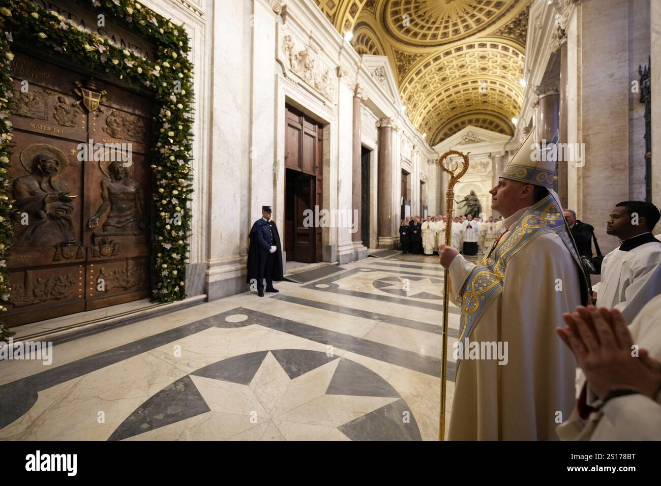 Cardinal Rolandas Makrickas, right, arrives to open the holy door of ...