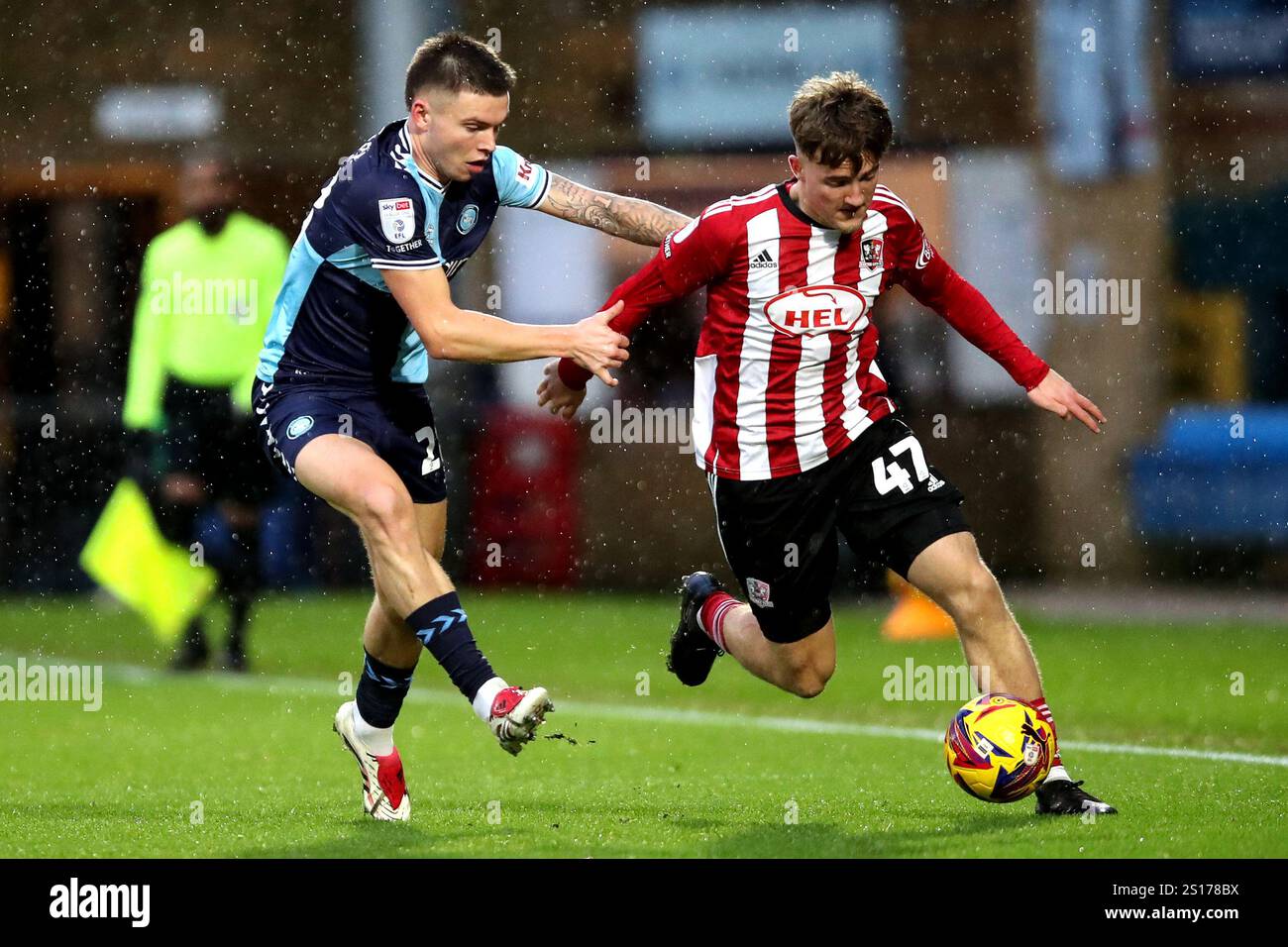 Wycombe Wanderers' Aaron Morley battles for the ball against Exeter ...