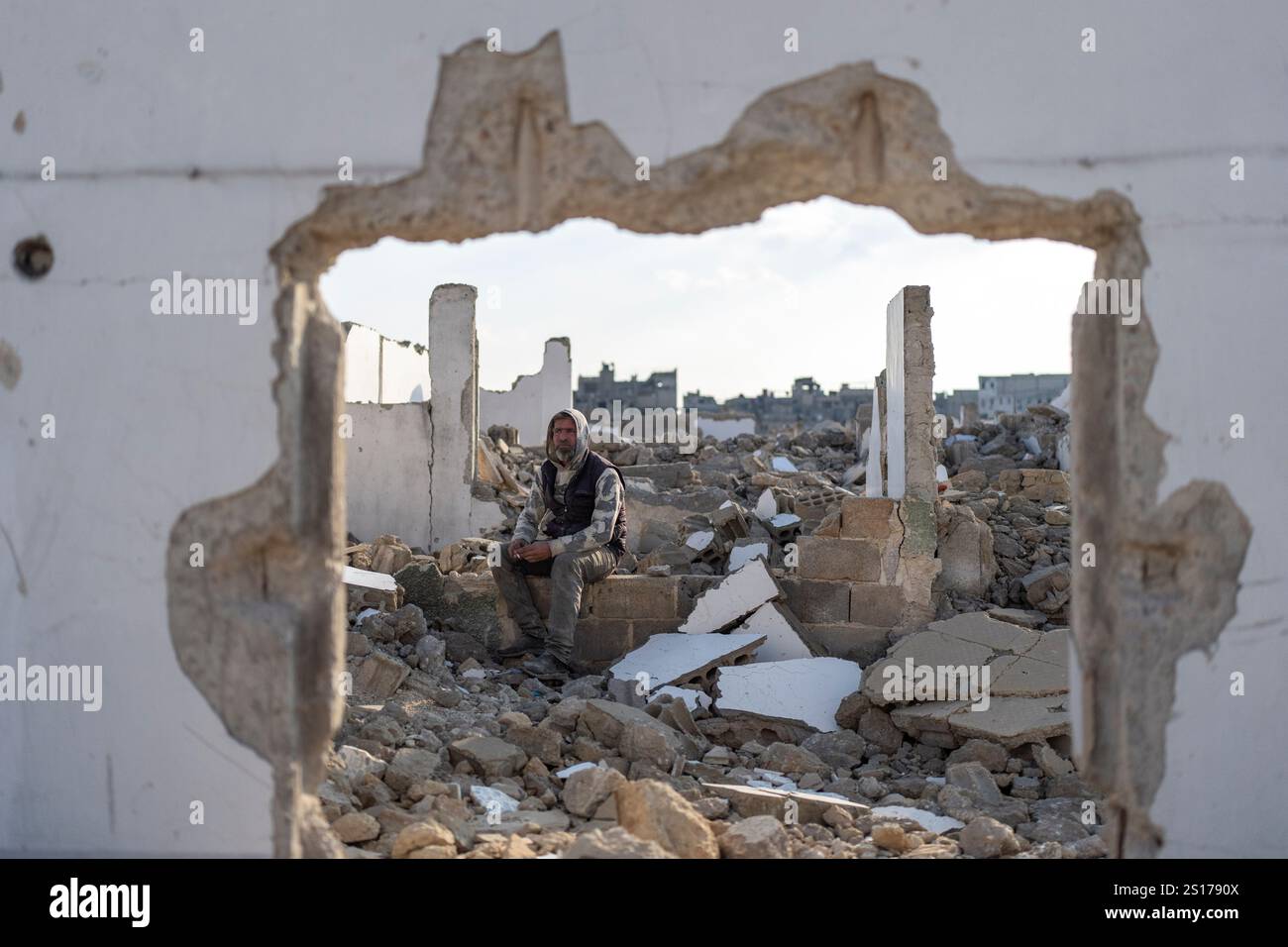 Nizar Al Hanash inspects the rubble of what used to be his home in Al ...