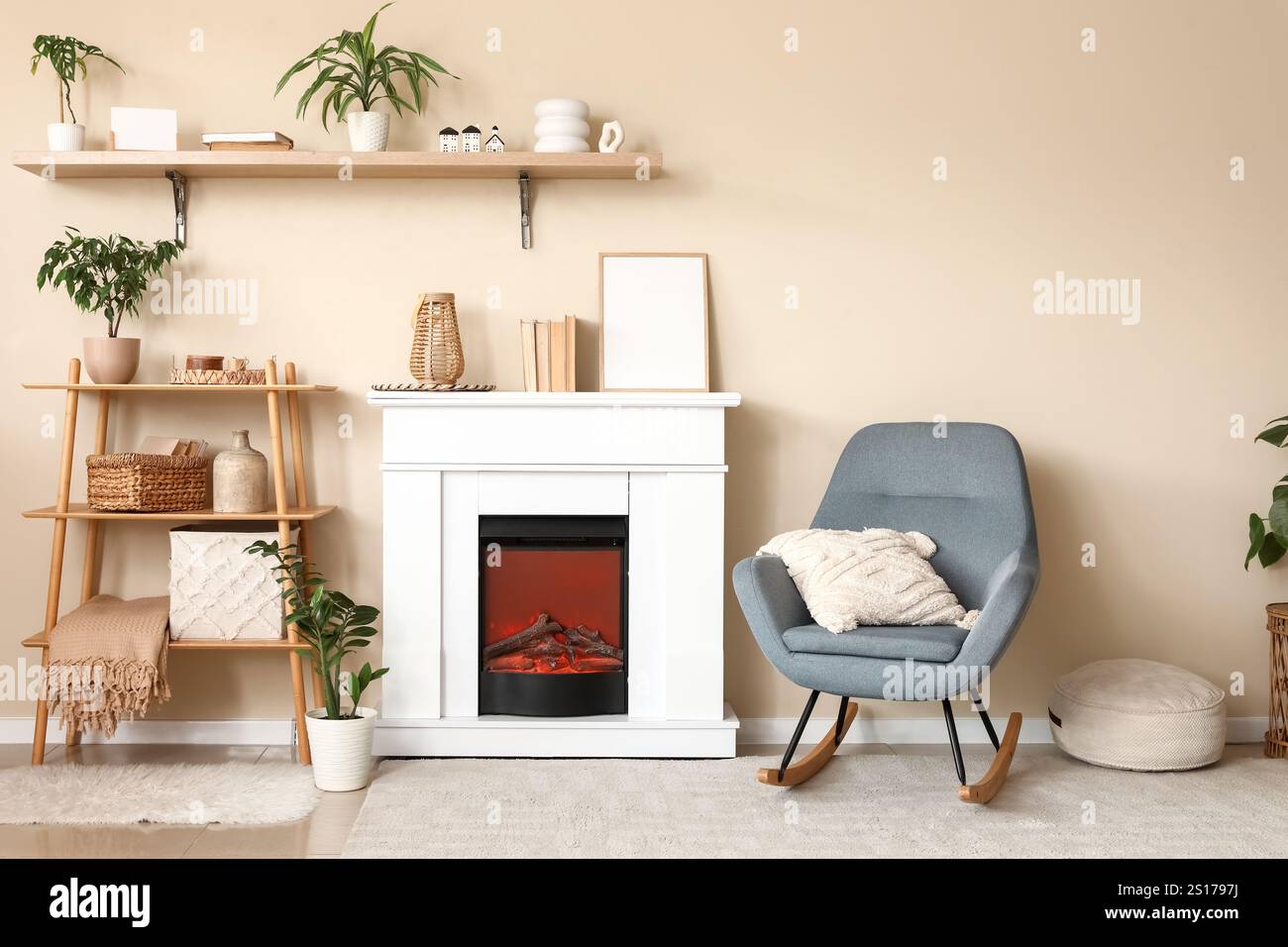 Interior of living room with fireplace, shelving unit and grey rocking ...