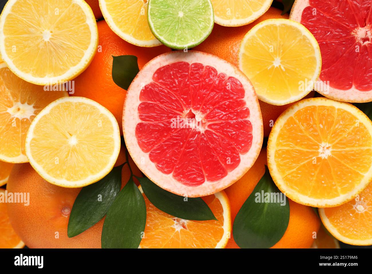 Texture of different citrus fruits and leaves as background Stock Photo ...