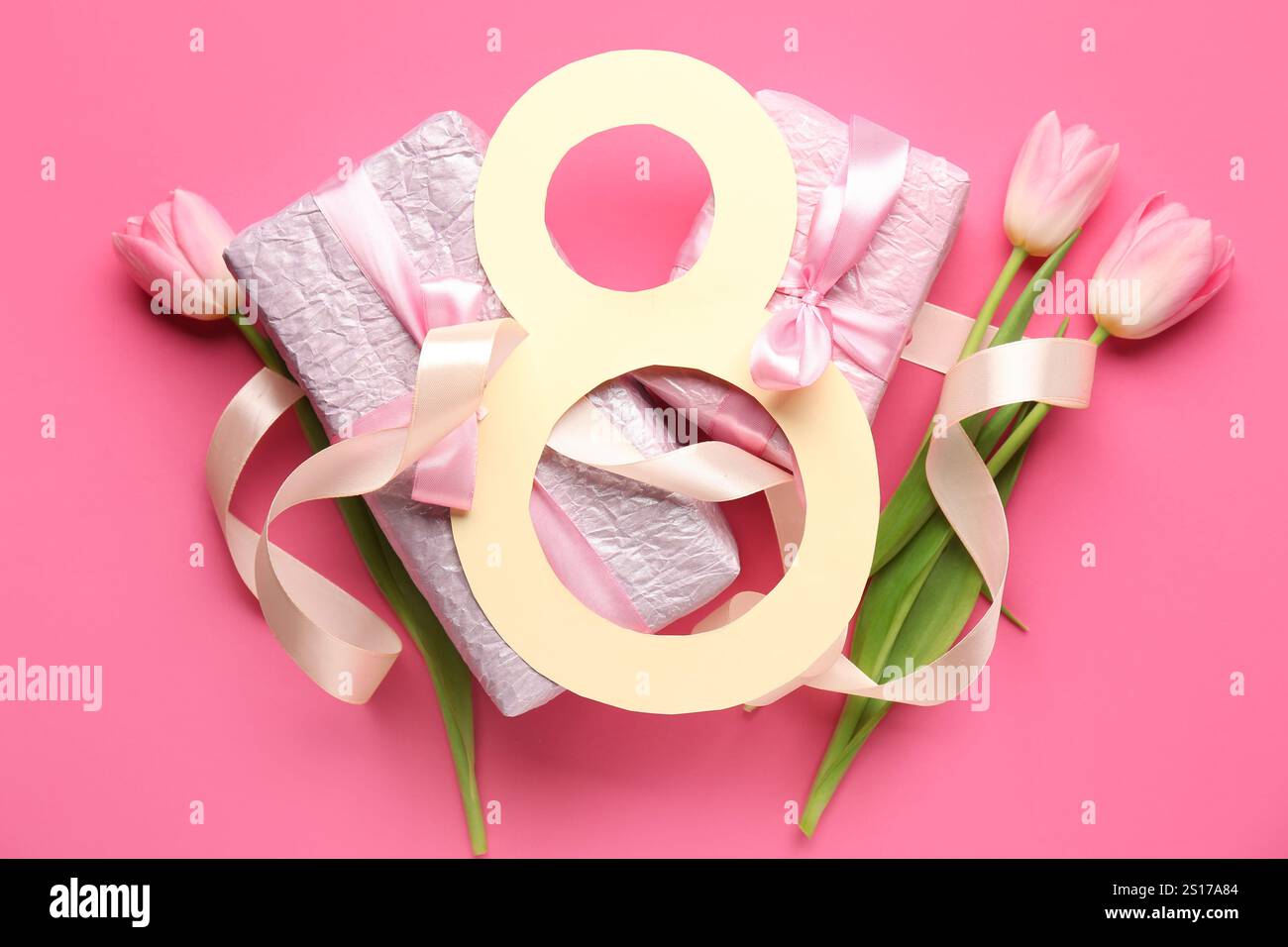 Paper figure 8 with gift boxes and tulips on pink background. Happy ...