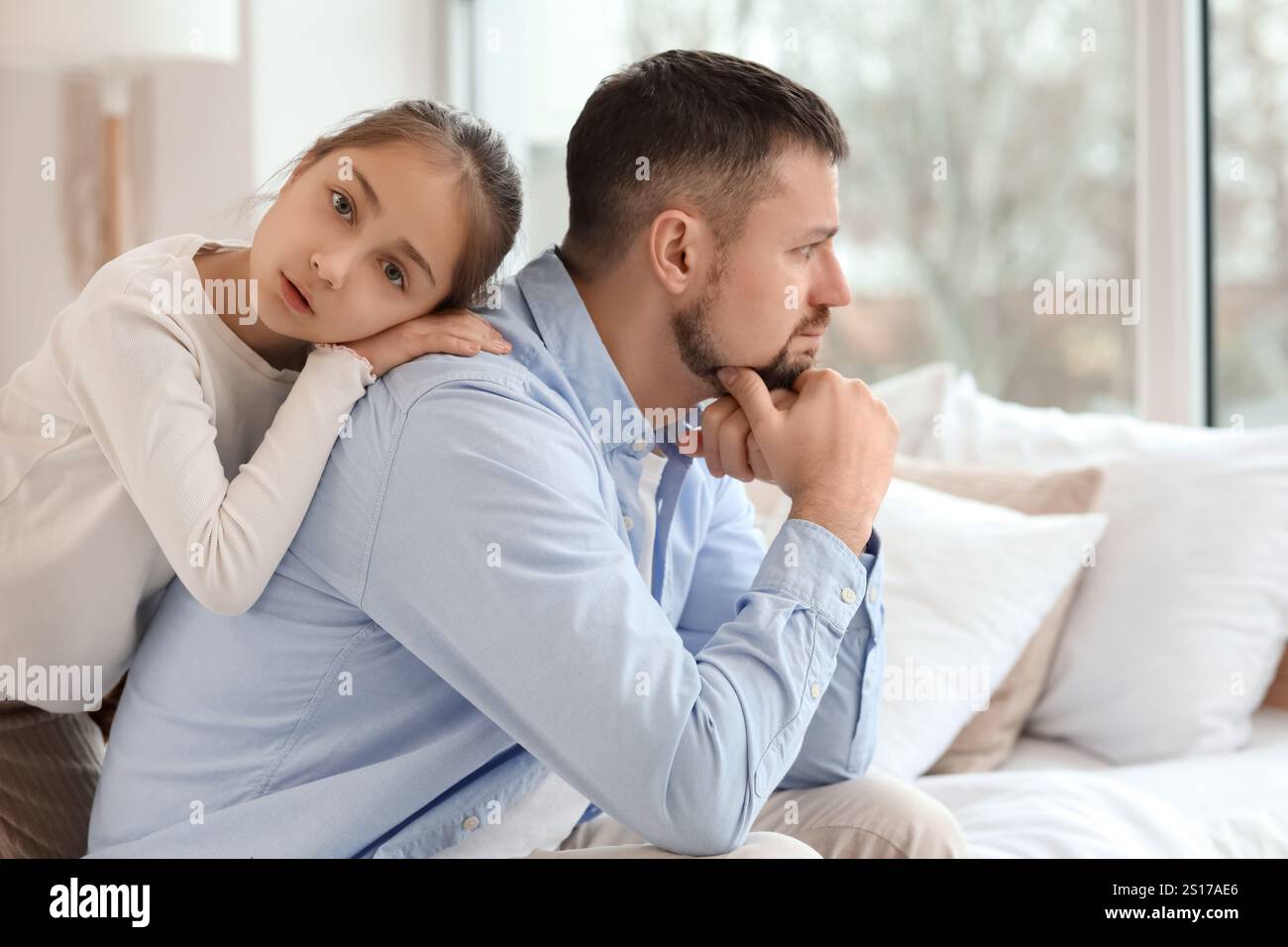 Cute girl apologizing to her father in bedroom Stock Photo - Alamy