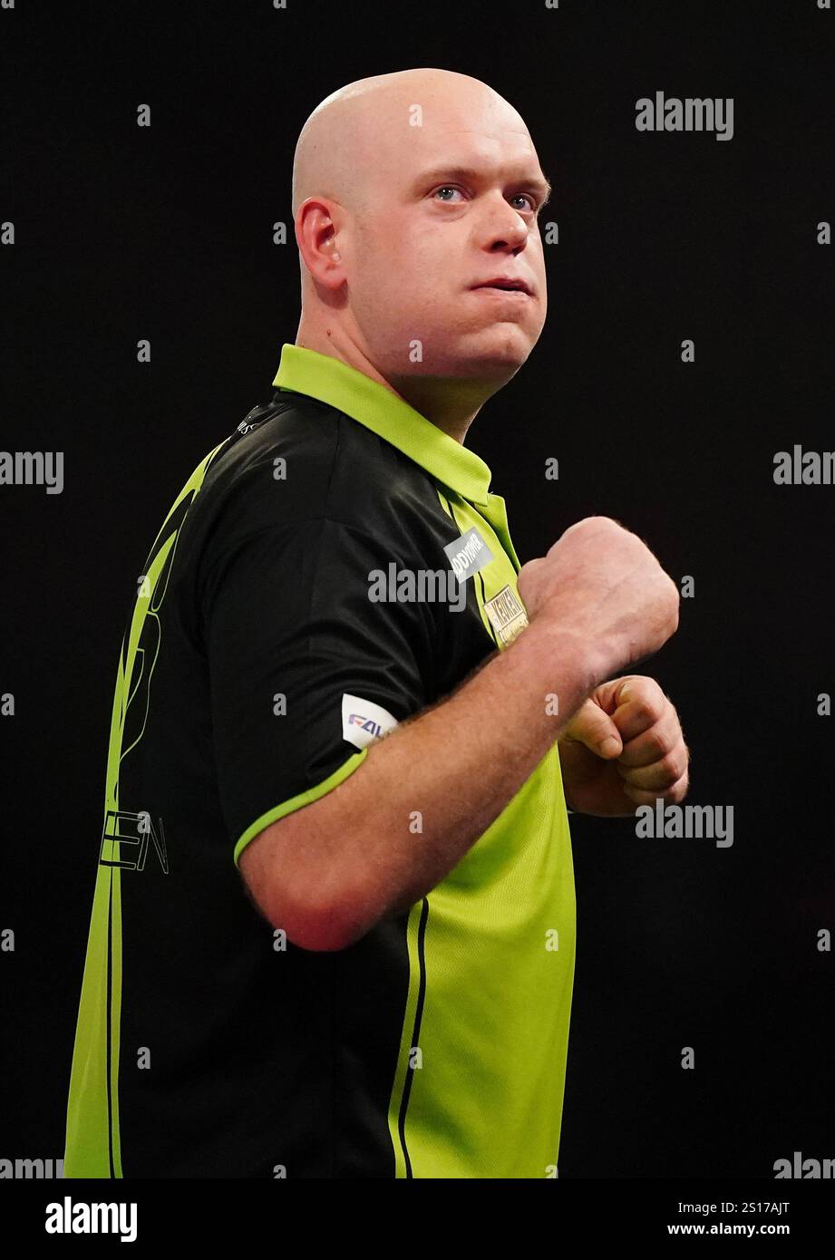 Michael van Gerwen celebrates after winning their quarter final match ...