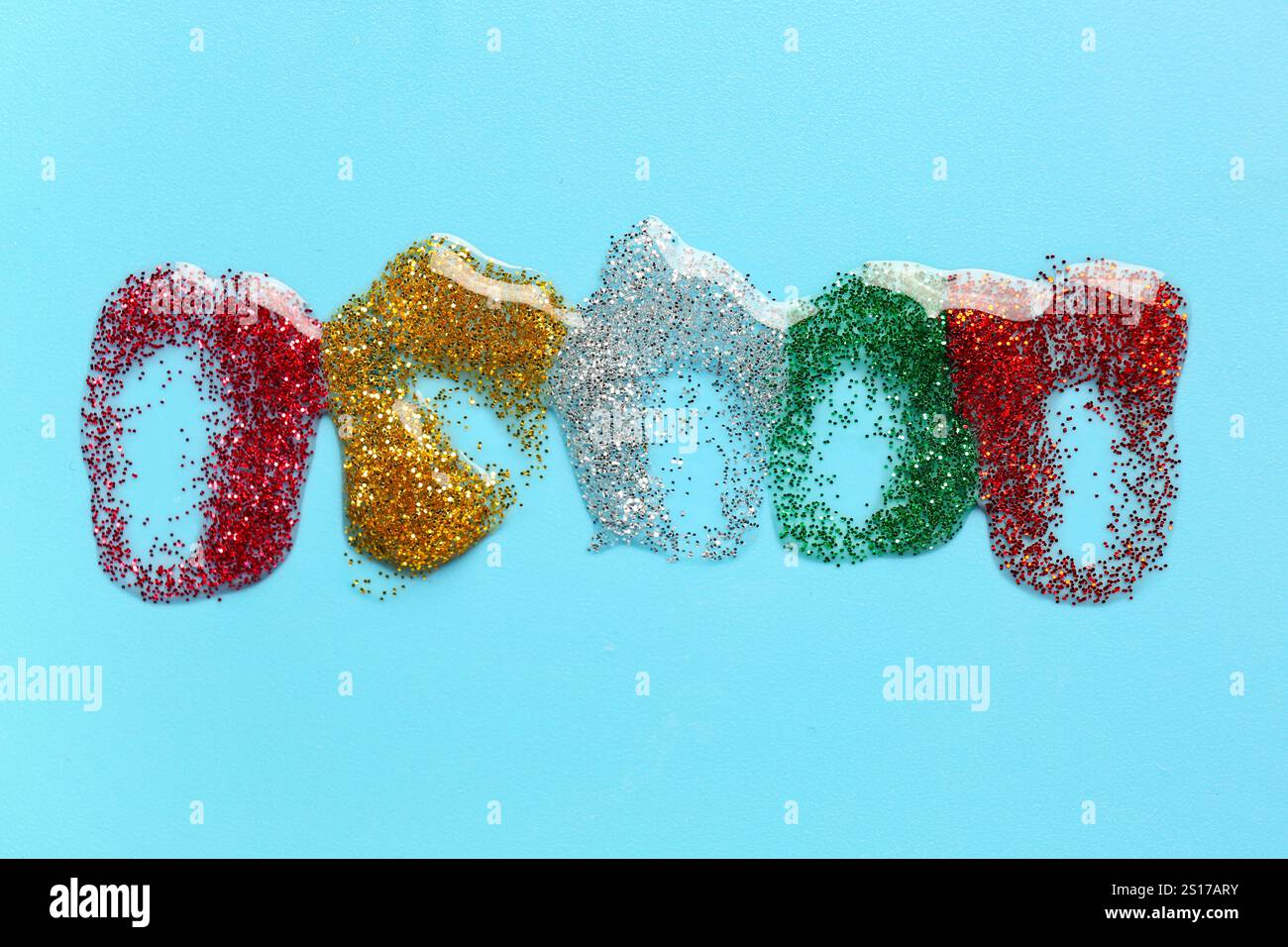Different glitter strokes on blue background, closeup Stock Photo - Alamy