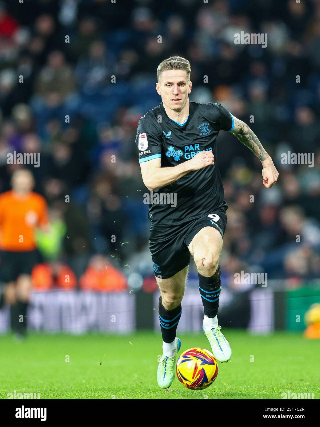 #9, Emil Riis of Preston races forward with the ball during the Sky Bet ...