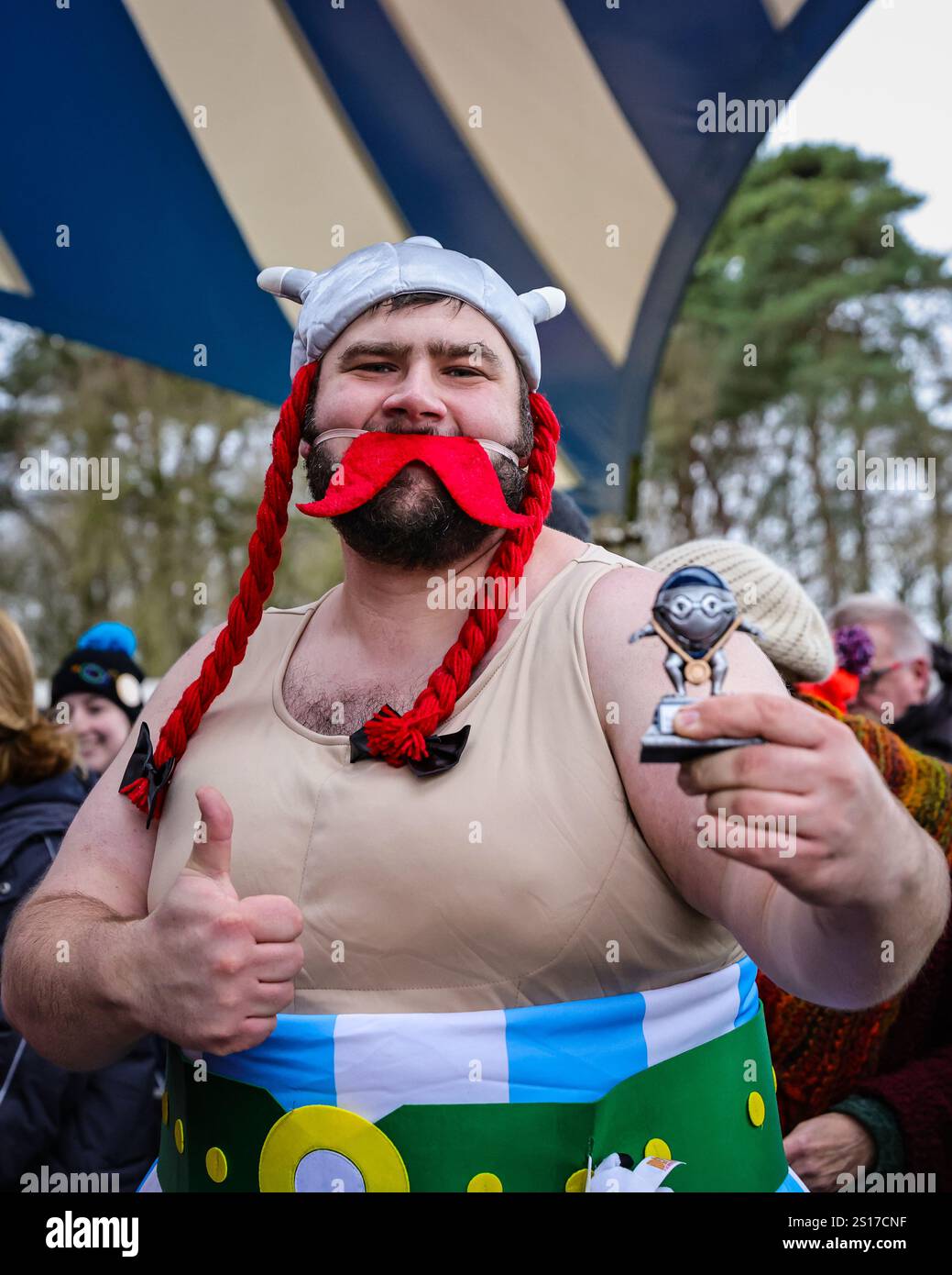 Haltern, Germany, 01st Jan 2025. A swimmer in Obelix the Gaul character ...