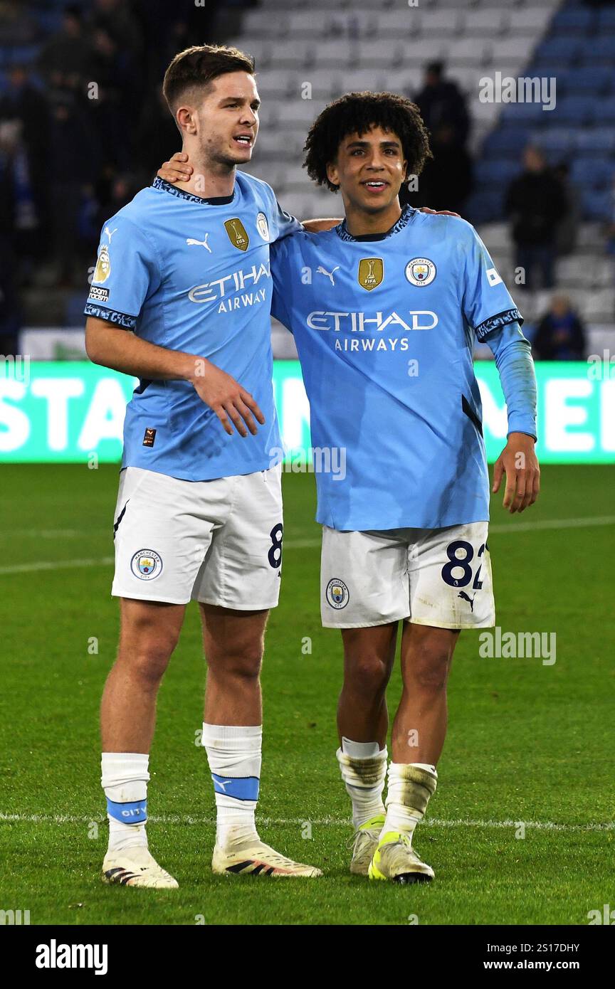 Manchester City's James McAtee, left, and Manchester City's Rico Lewis ...