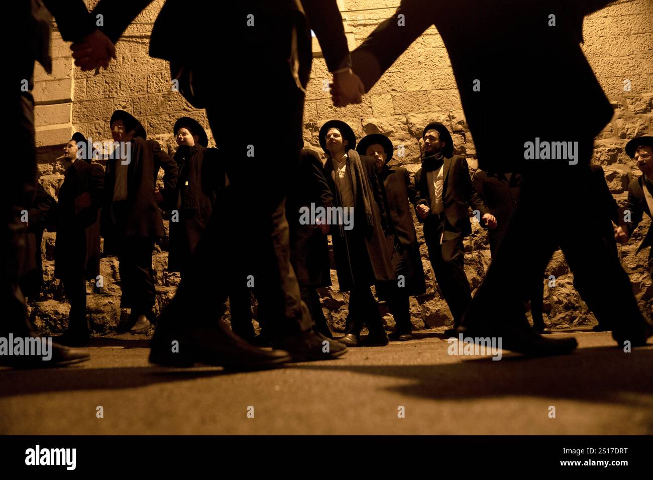 Ultra-Orthodox Jewish yeshiva students dance after lighting candles to ...
