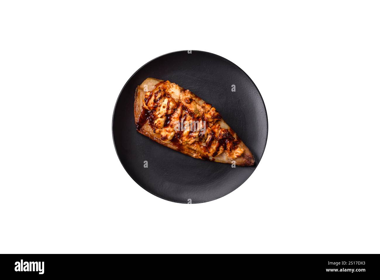 Grilled mackerel fillets with cheese, salt, spices and herbs on a white ...