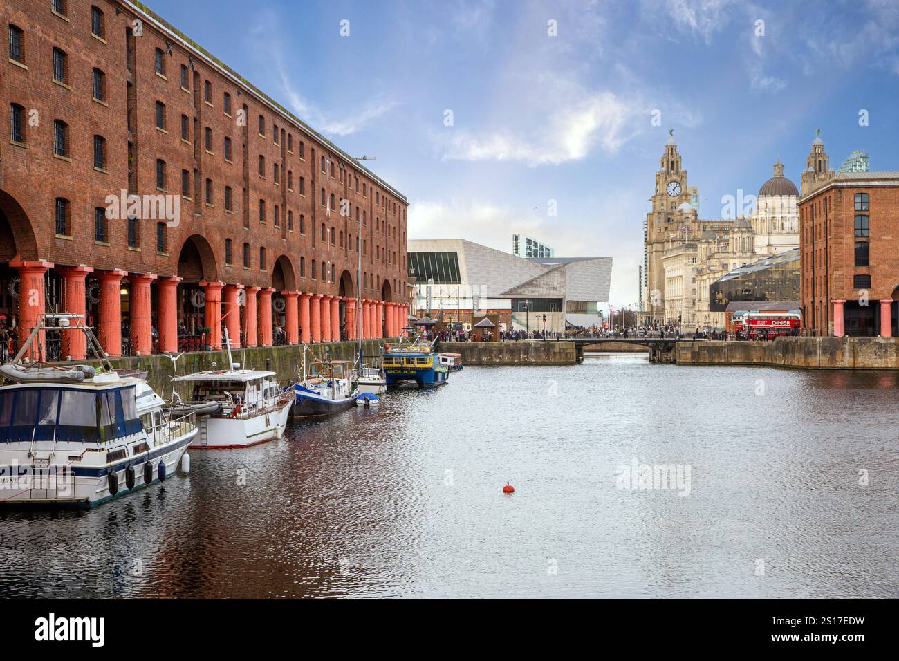 Boats moored by the buildings of the Albert Docks in the Merseyside ...