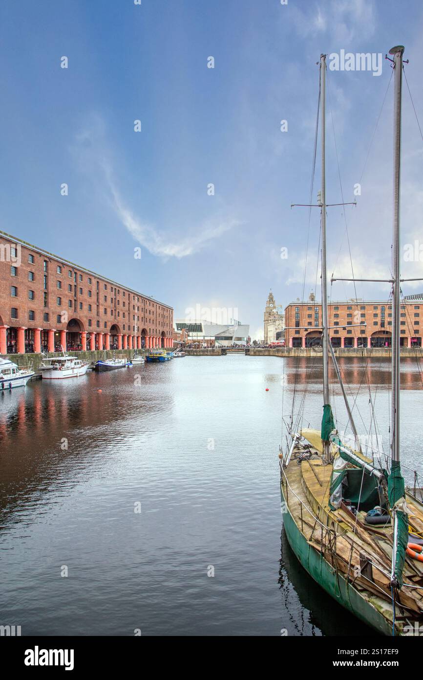 Boats moored by the buildings of the Albert Docks in the Merseyside ...