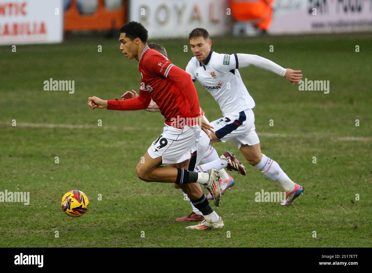 Morecambe, UK. 01st Jan, 2025. Marcus Dackers of Morecambe makes a ...