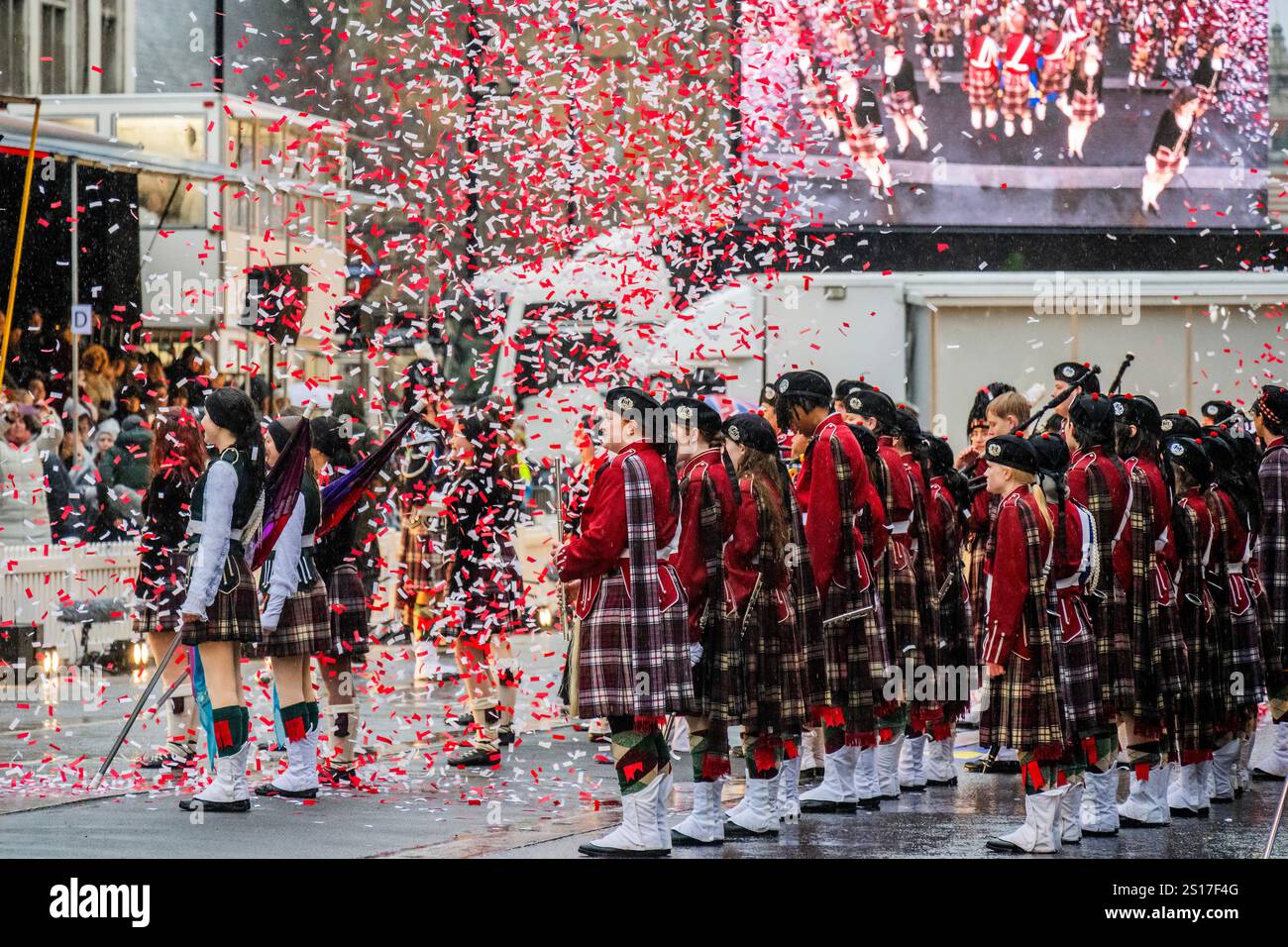 London, UK. 1st Jan, 2025. People in the parade and in the crowd take ...
