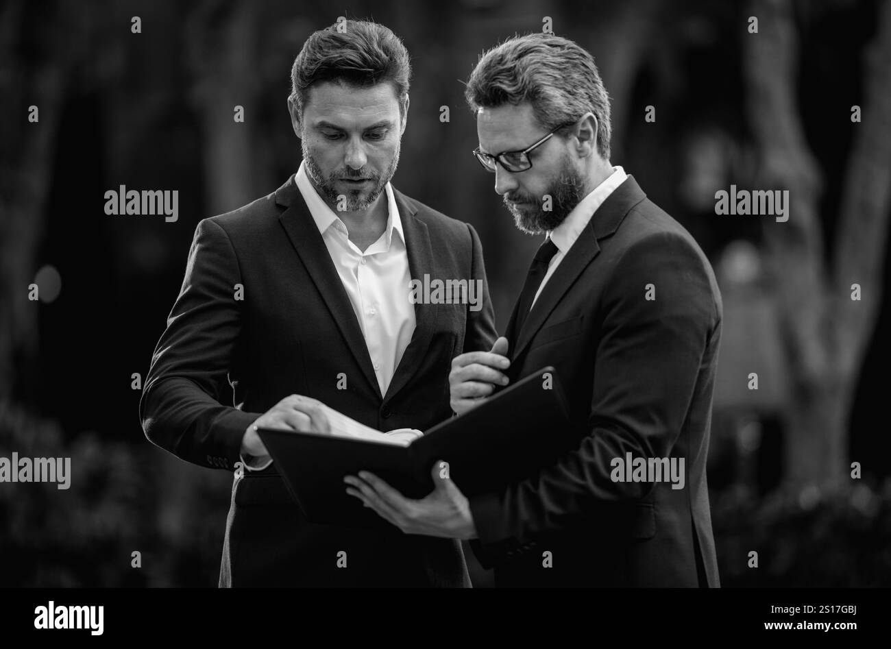 Two confident men discussing Black and White Stock Photos & Images - Alamy