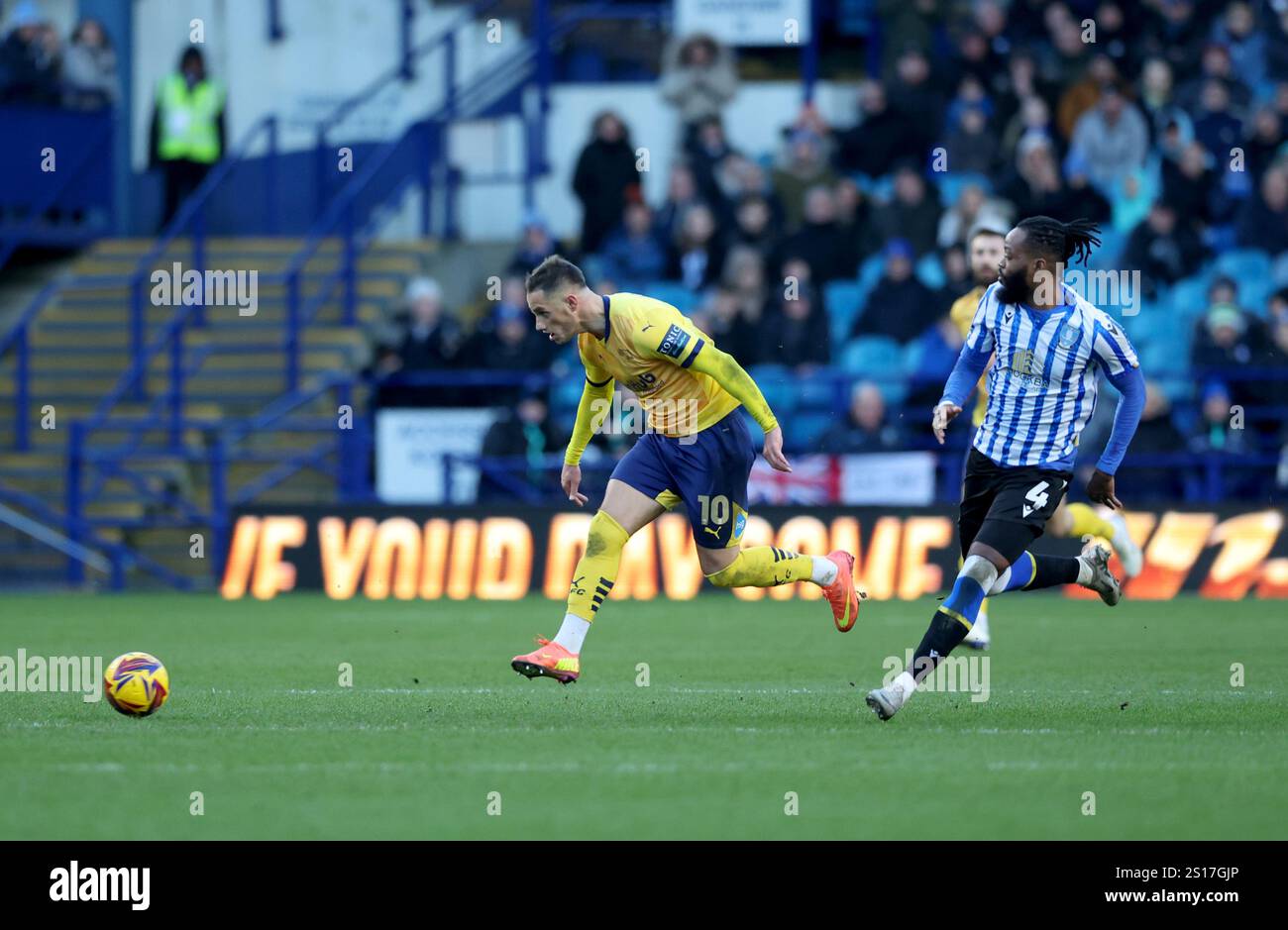 Derby County's Jerry Yates (left) and Sheffield Wednesday's Nathaniel ...