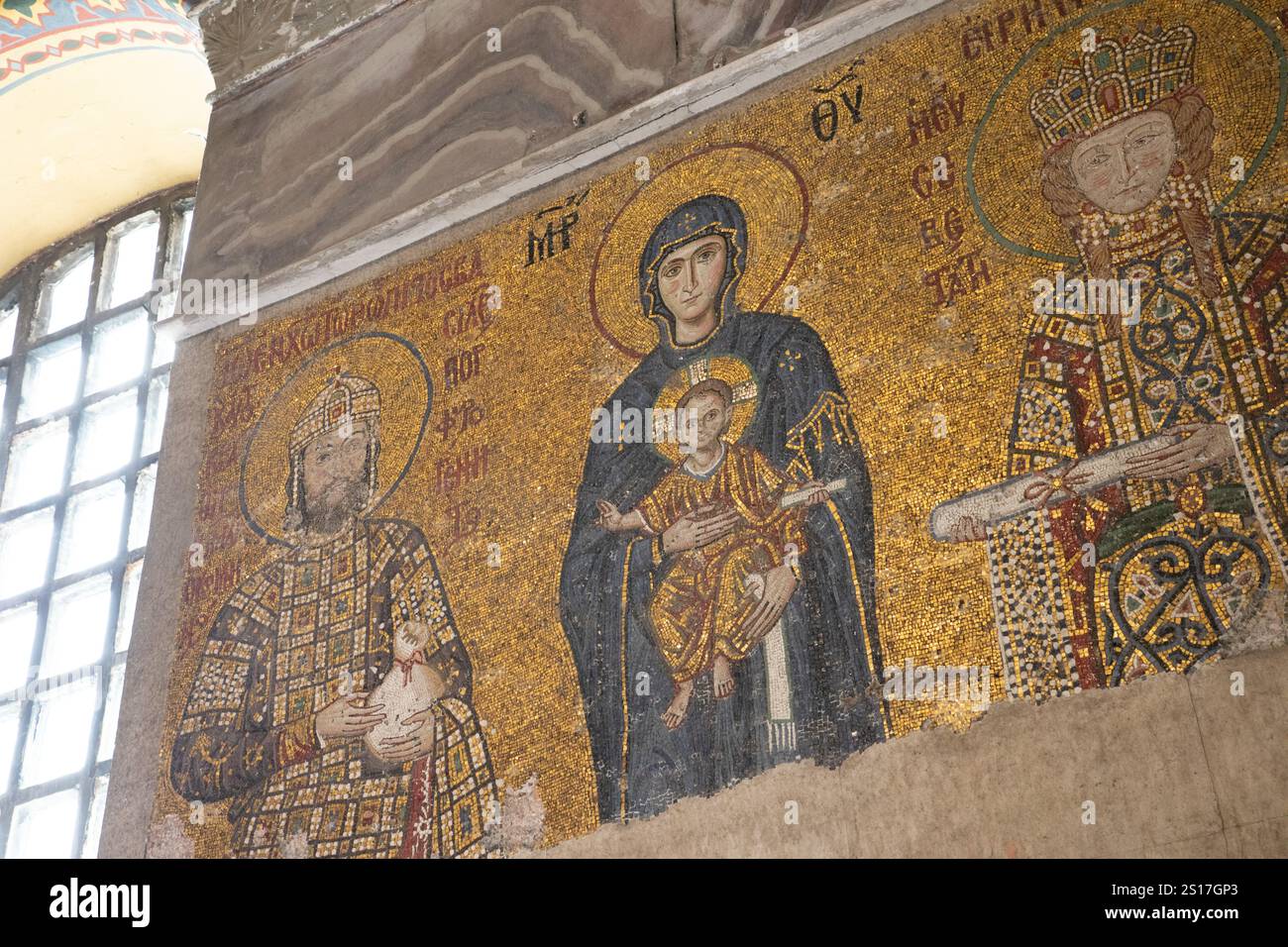 A mosaic featuring the Virgin Mary with Christ Child at its centre ...