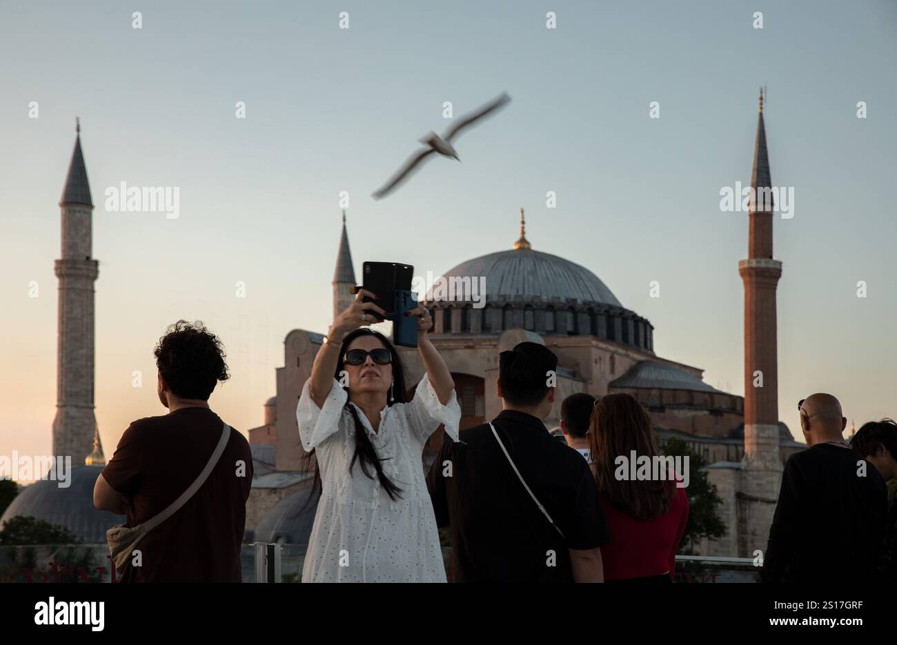 Visitors in front of the Hagia Sophia Grand Mosque in Istanbul, Turkey ...