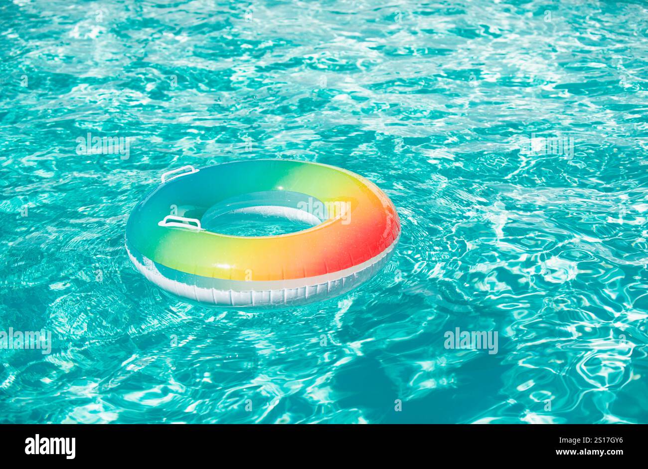 Pool float, ring floating in a refreshing blue swimming pool on summer ...
