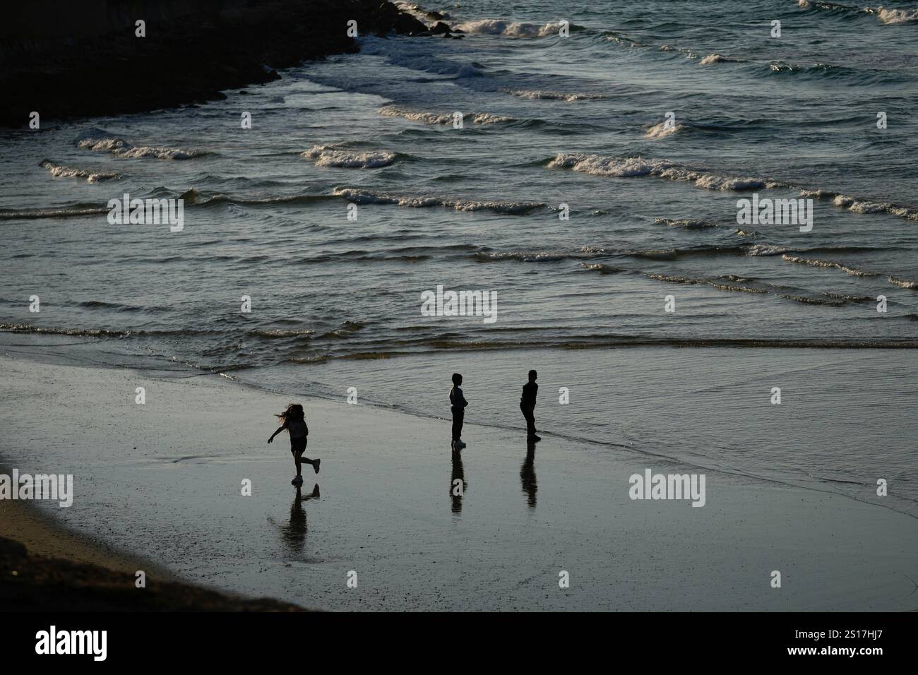 Children play near the shore of a beach in Tel Aviv, Israel, Wednesday ...