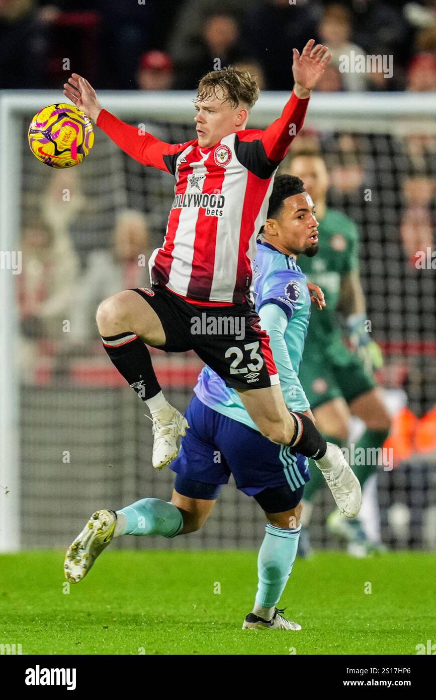 Brentford's Keane Lewis-Potter, foreground, jumps for the ball next to ...