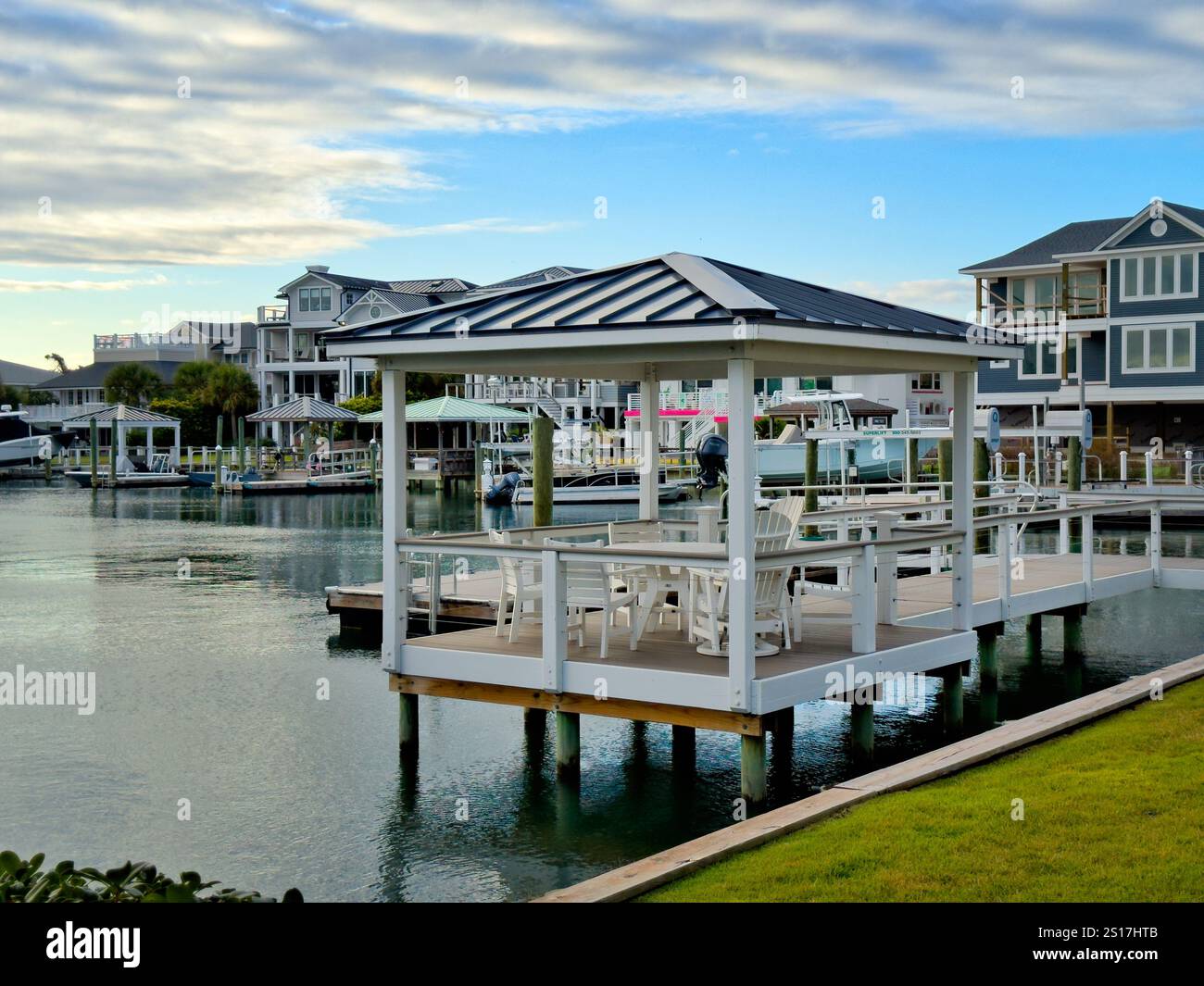 A beautiful, scenic waterfront featuring a gazebo surrounded by ...