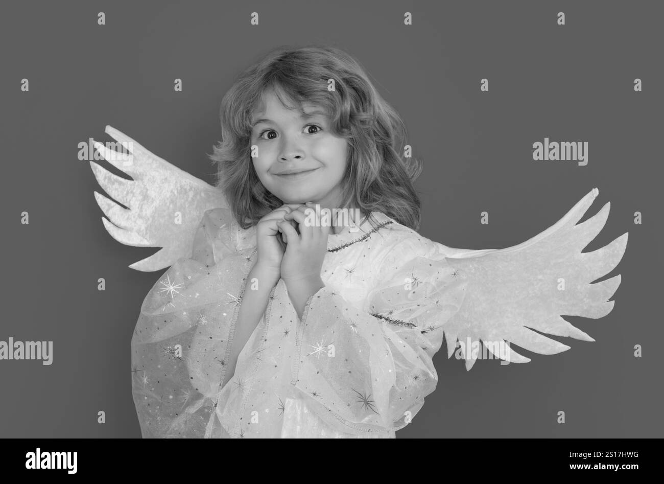 Christmas kids. Little cupid angel child with wings. Studio portrait of ...
