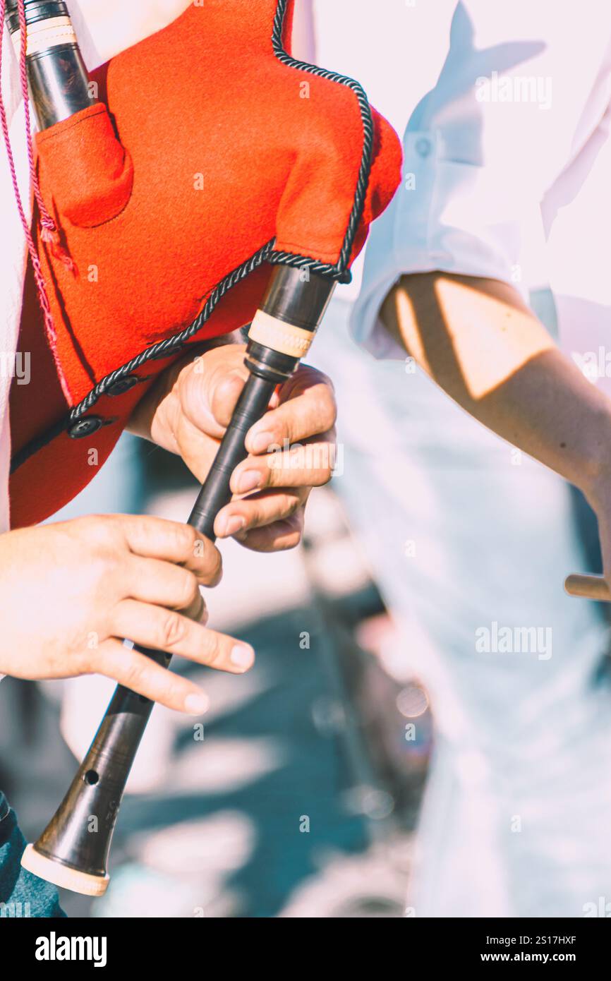 view of the fingers of a bagpiper from Portugal playing the traditional ...