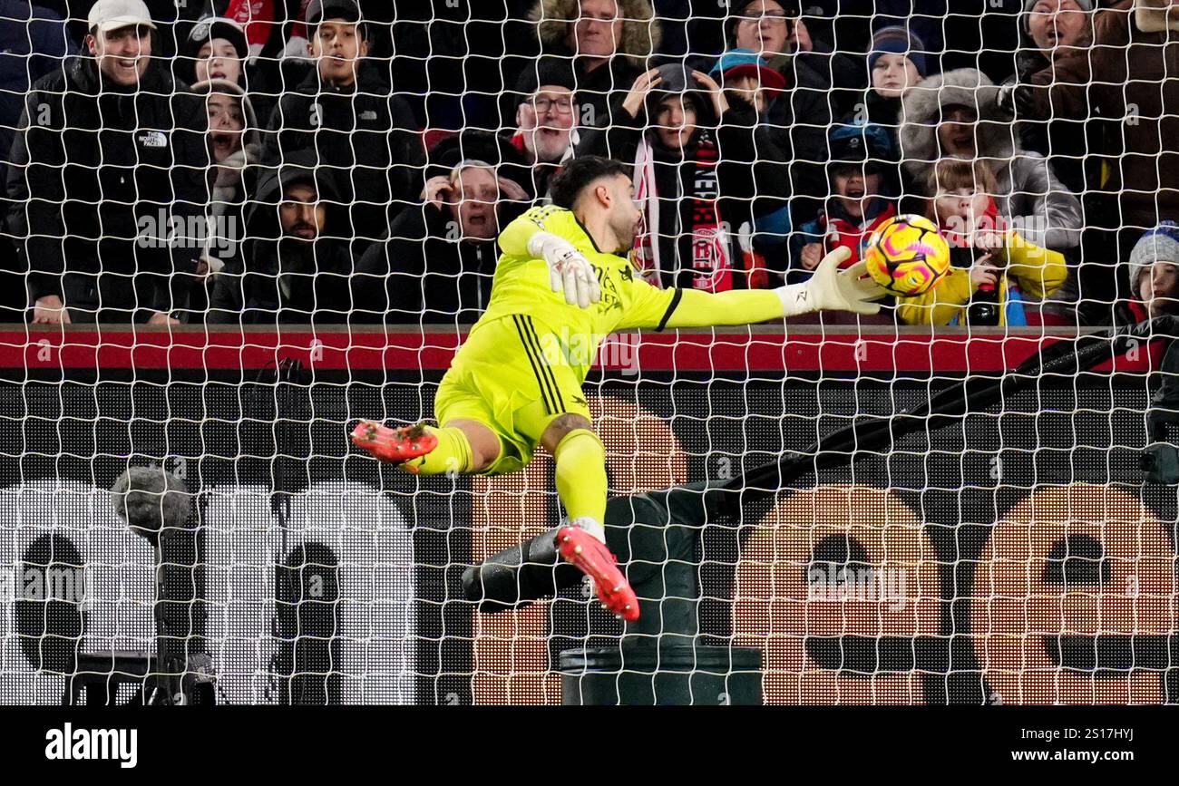 Arsenal goalkeeper David Raya makes a save off the line during the ...