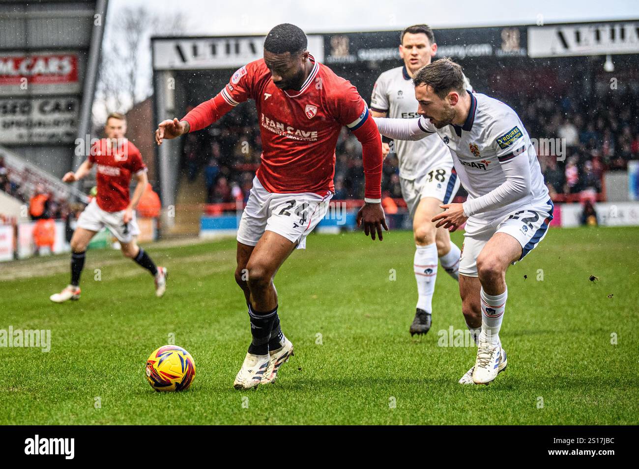 Morecambe FC's Yann Songo'o under pressure from Lee O'Connor of ...