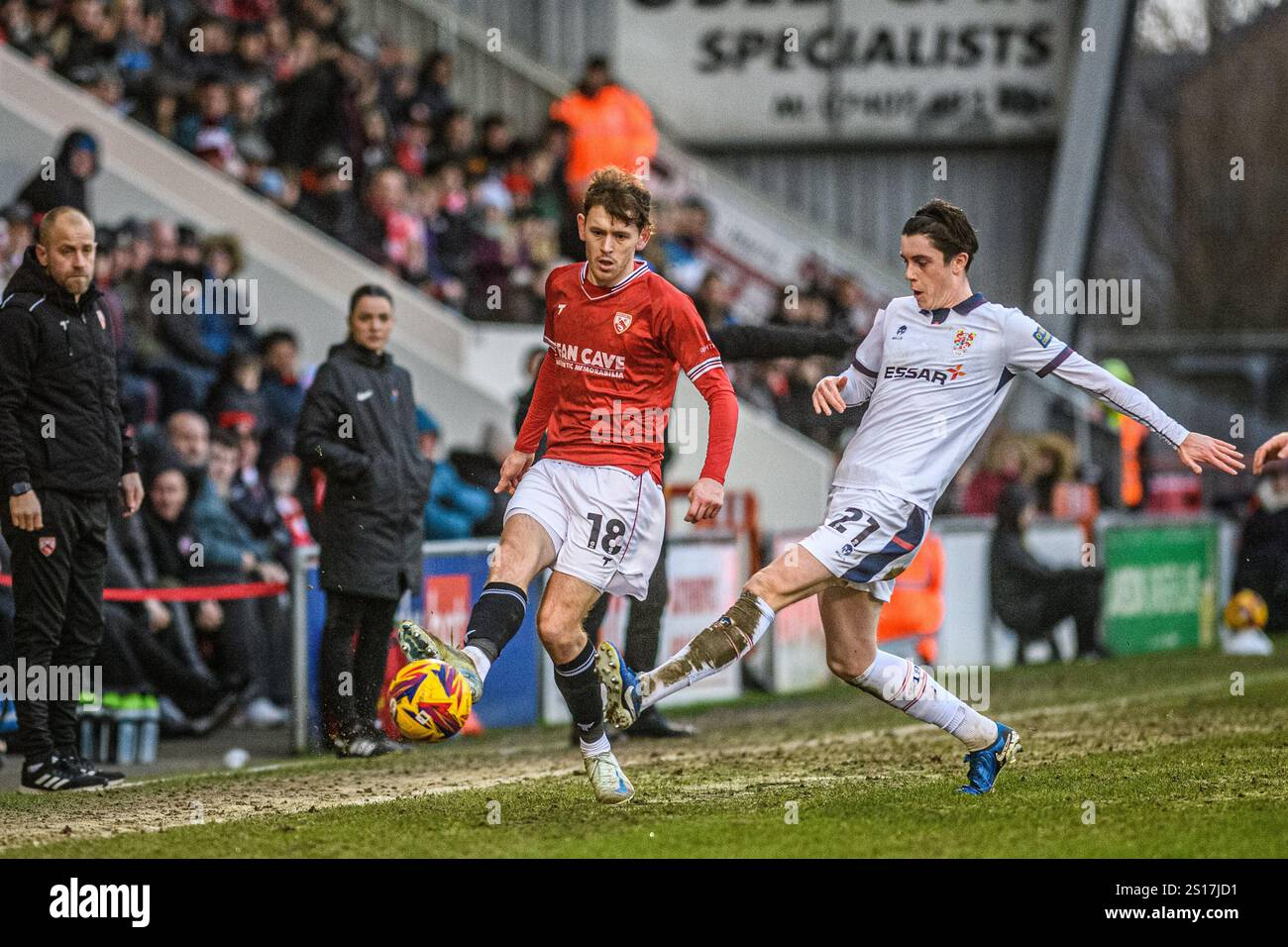 Sol Solomon of Tranmere Rovers FC tackles Morecambe FC's Ben Tollitt ...