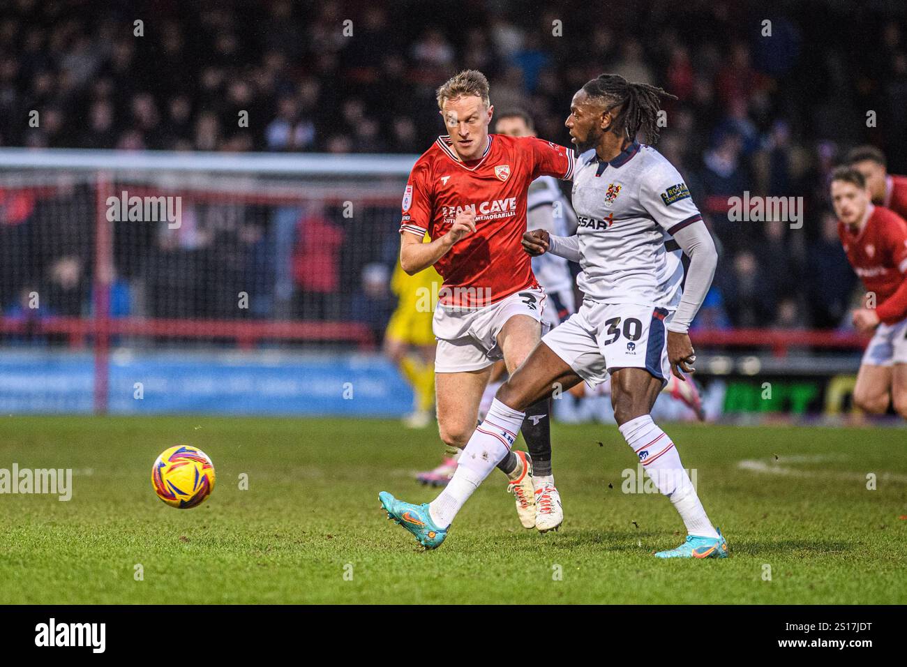 Omari Patrick of Tranmere Rovers FC under pressure from Morecambe FC's ...