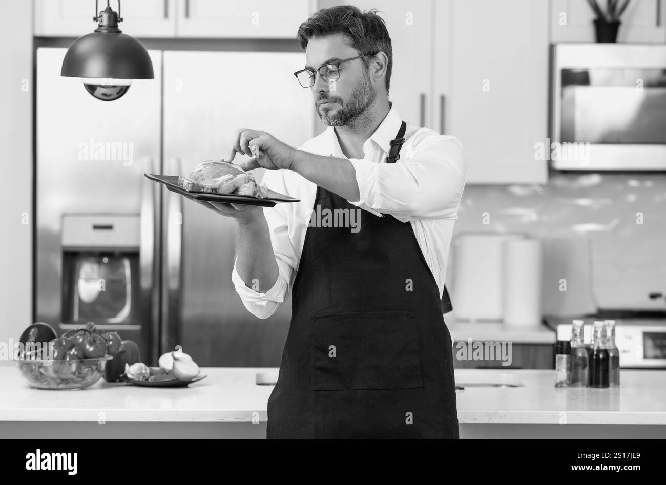 Beef steak grilling in Black and White Stock Photos & Images - Alamy