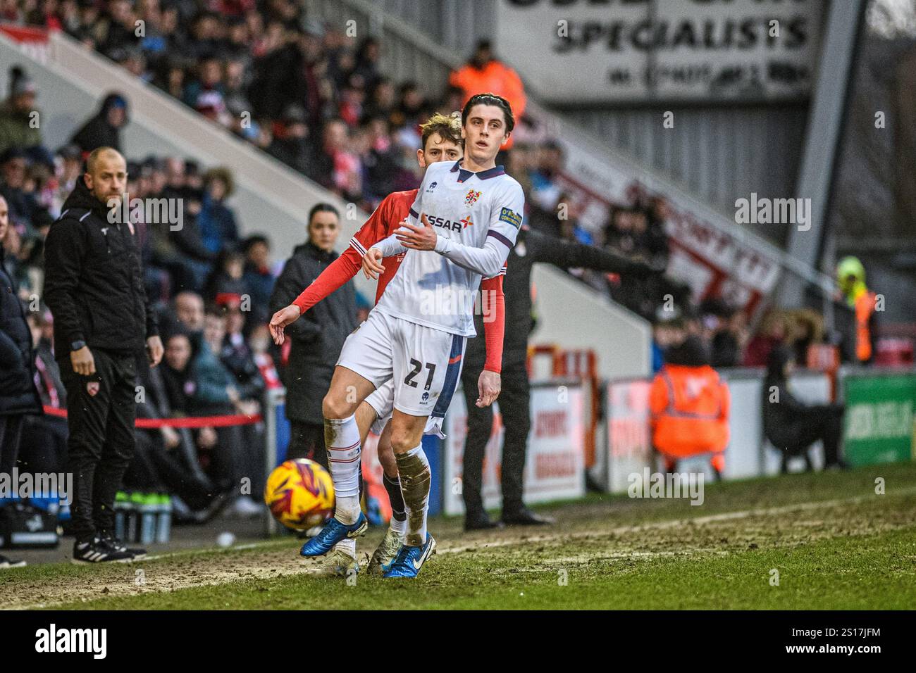 Sol Solomon of Tranmere Rovers FC tackles Morecambe FC's Ben Tollitt ...