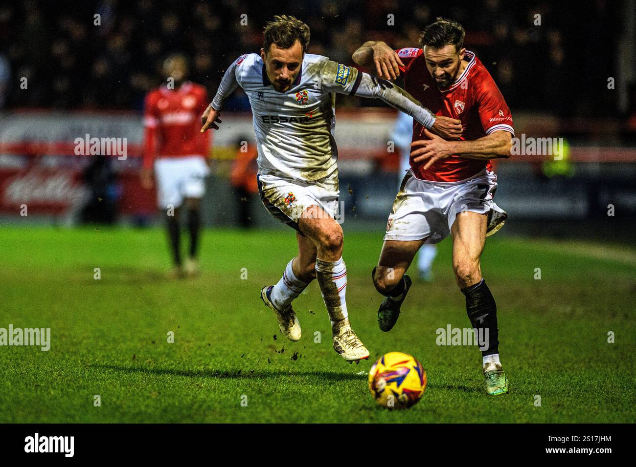 Sol Solomon of Tranmere Rovers FC tackles Morecambe FC's Gwion Edwards ...