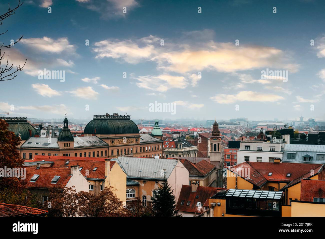 Scenic cityscape with a cloudy sky, historic rooftops and architectural ...