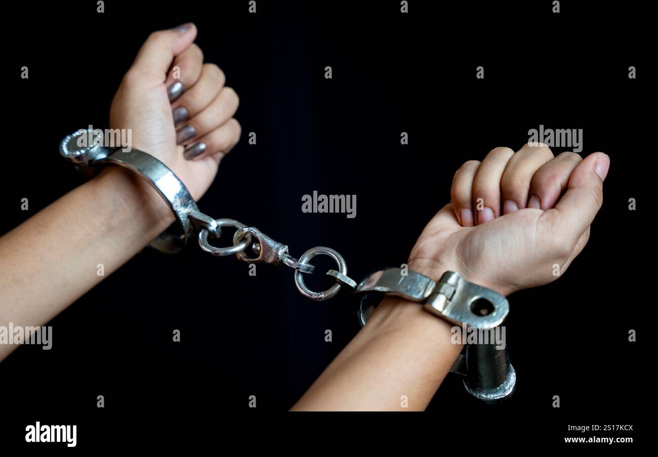 Woman hands in handcuffs Stock Photo - Alamy