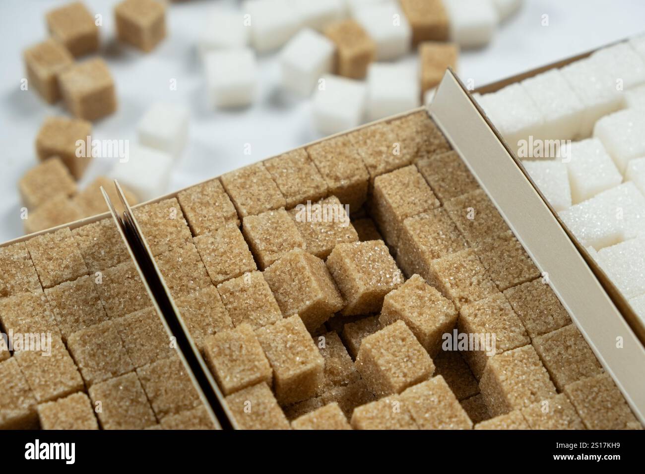 Cubes of demerara cane sugar and white beet sugar top view Stock Photo ...