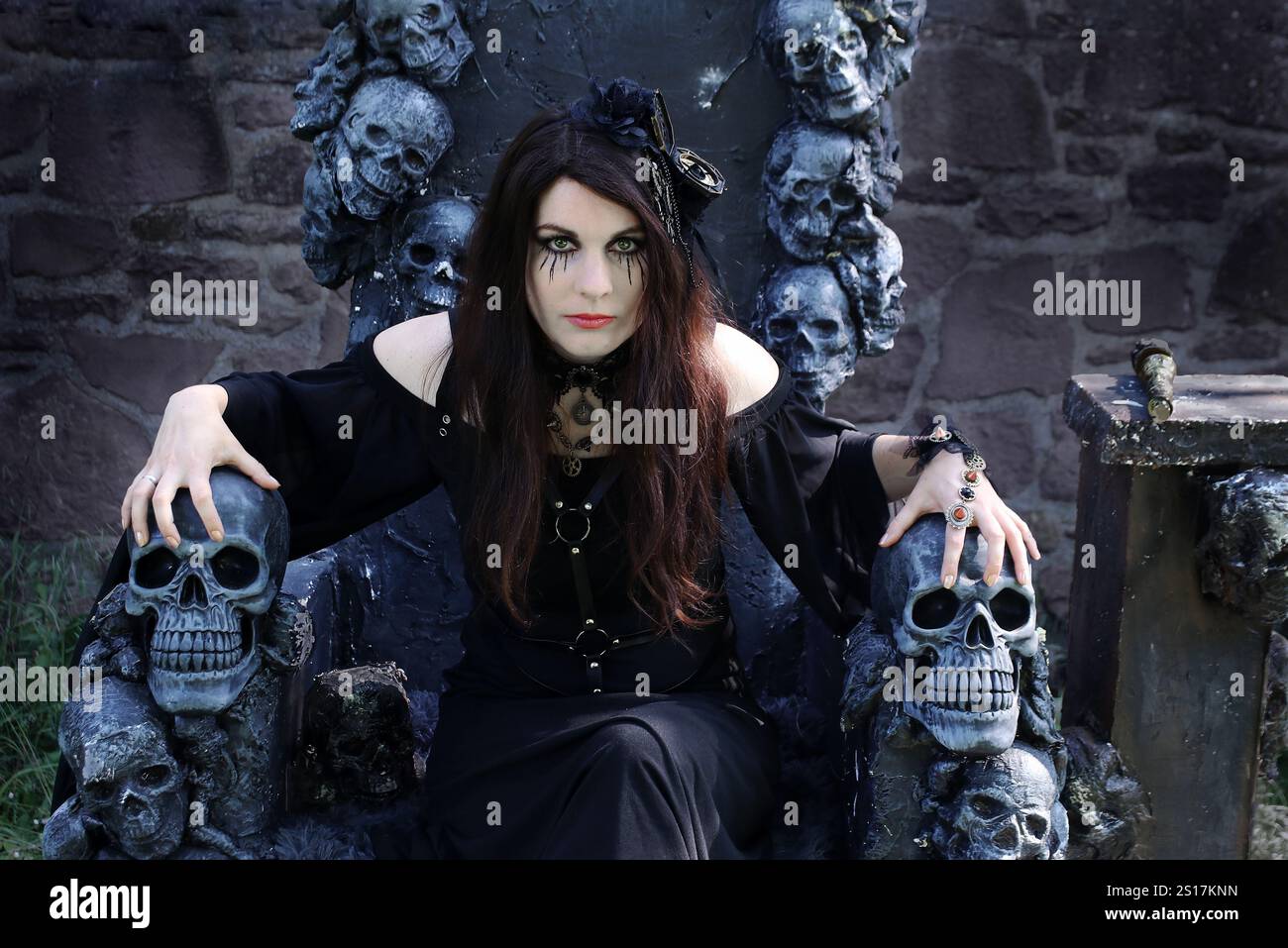 Fantasy photo with an evil witch on a throne with skulls Stock Photo ...