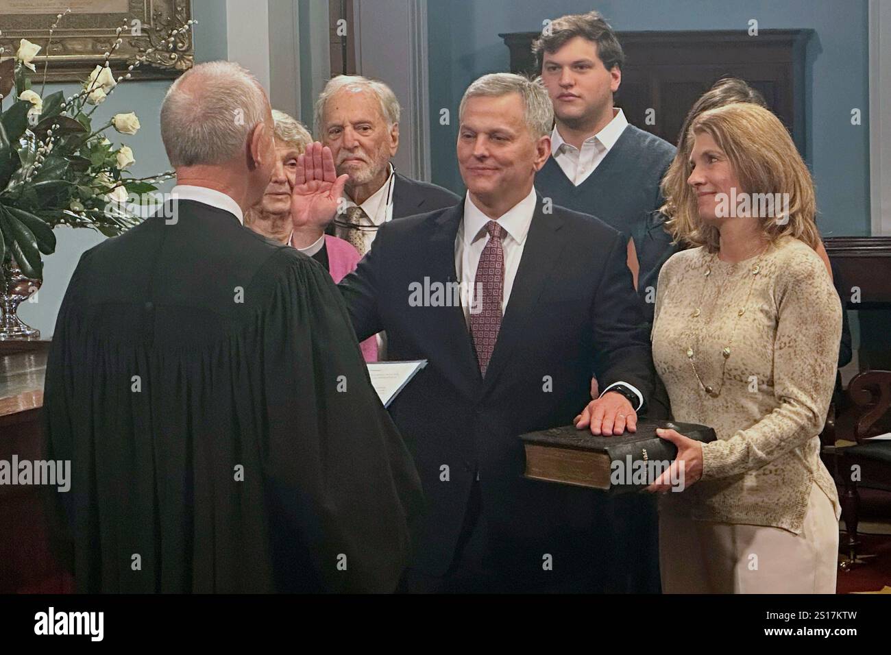 North Carolina Gov. Josh Stein, center, takes the oath of office from ...